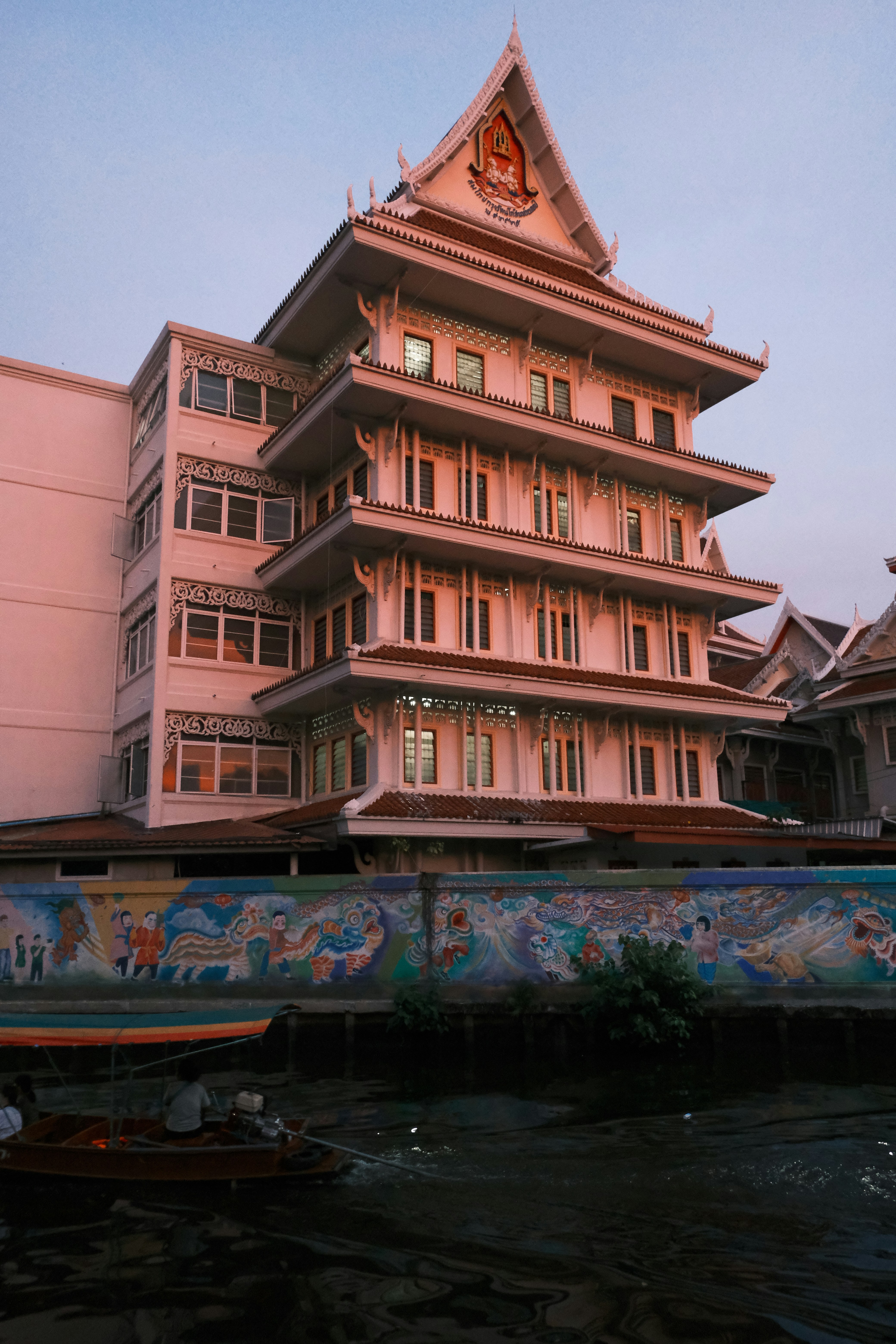 Temple-tower on the canal at dusk