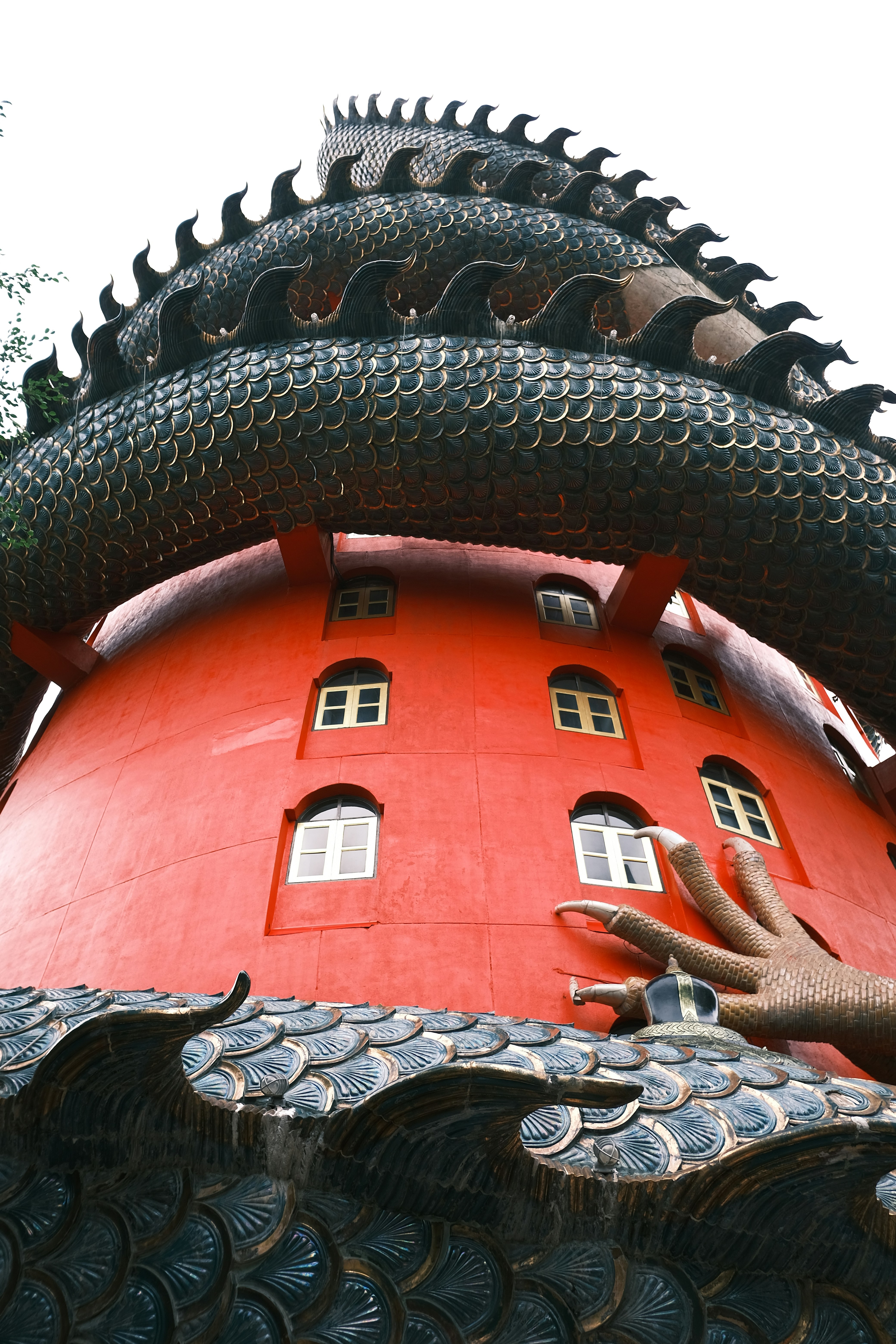 Scaled Dragon: A Red Tower Surrounded by Coiled Plates