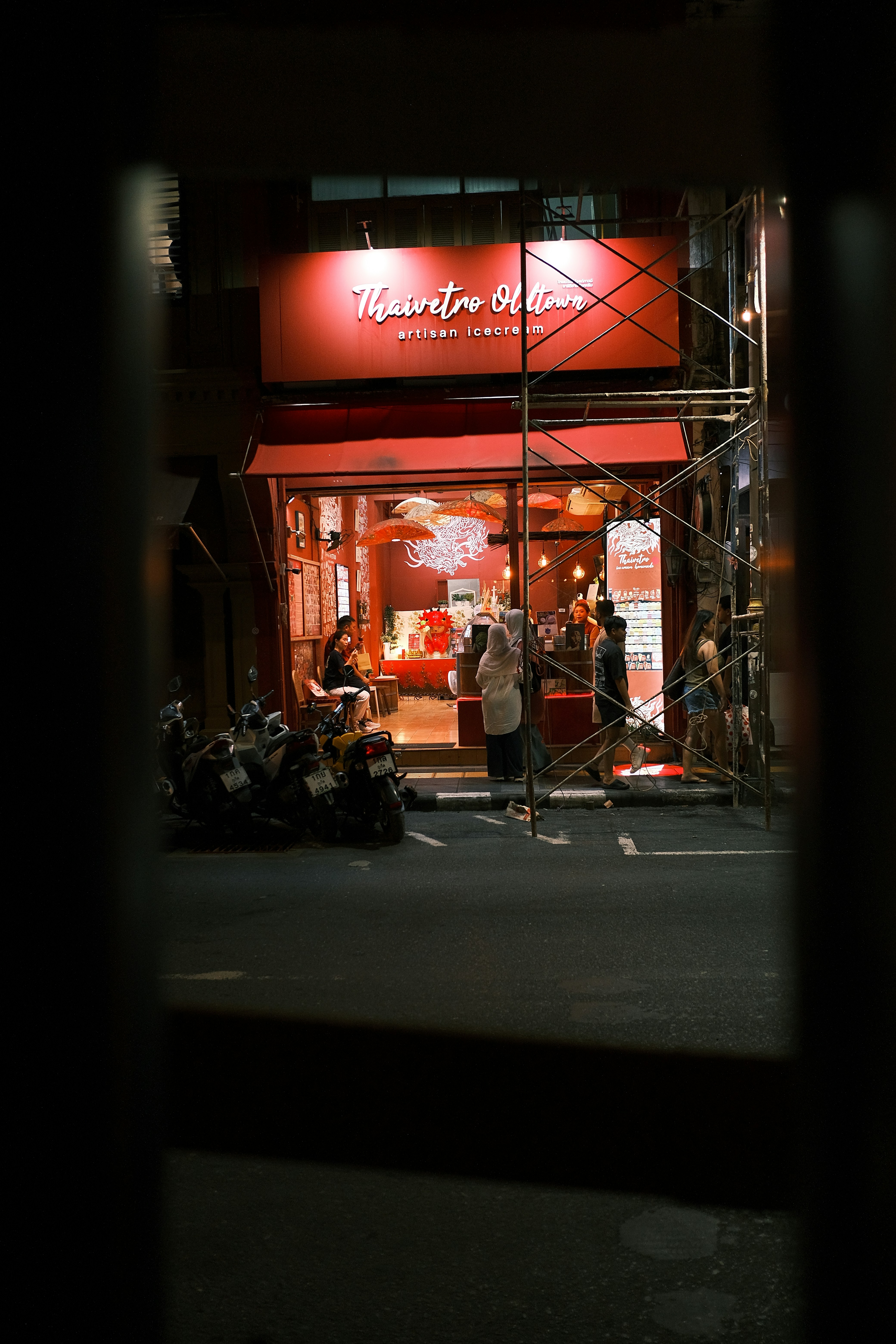 Neon Red Threshold: Nightlife Through a Phrontal Window