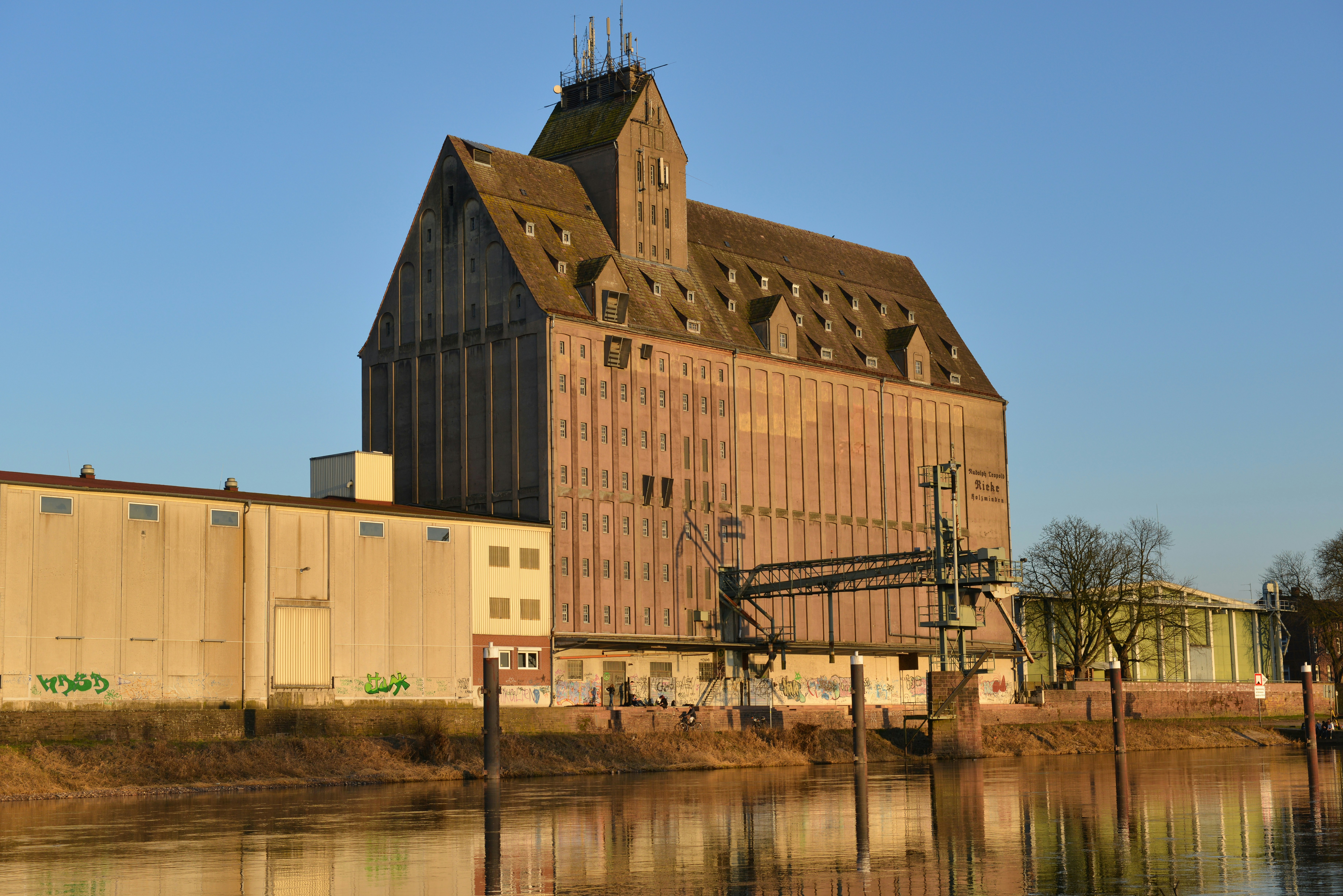 Industrial Slipstream: Old Grain Elevator Reflecting on the River