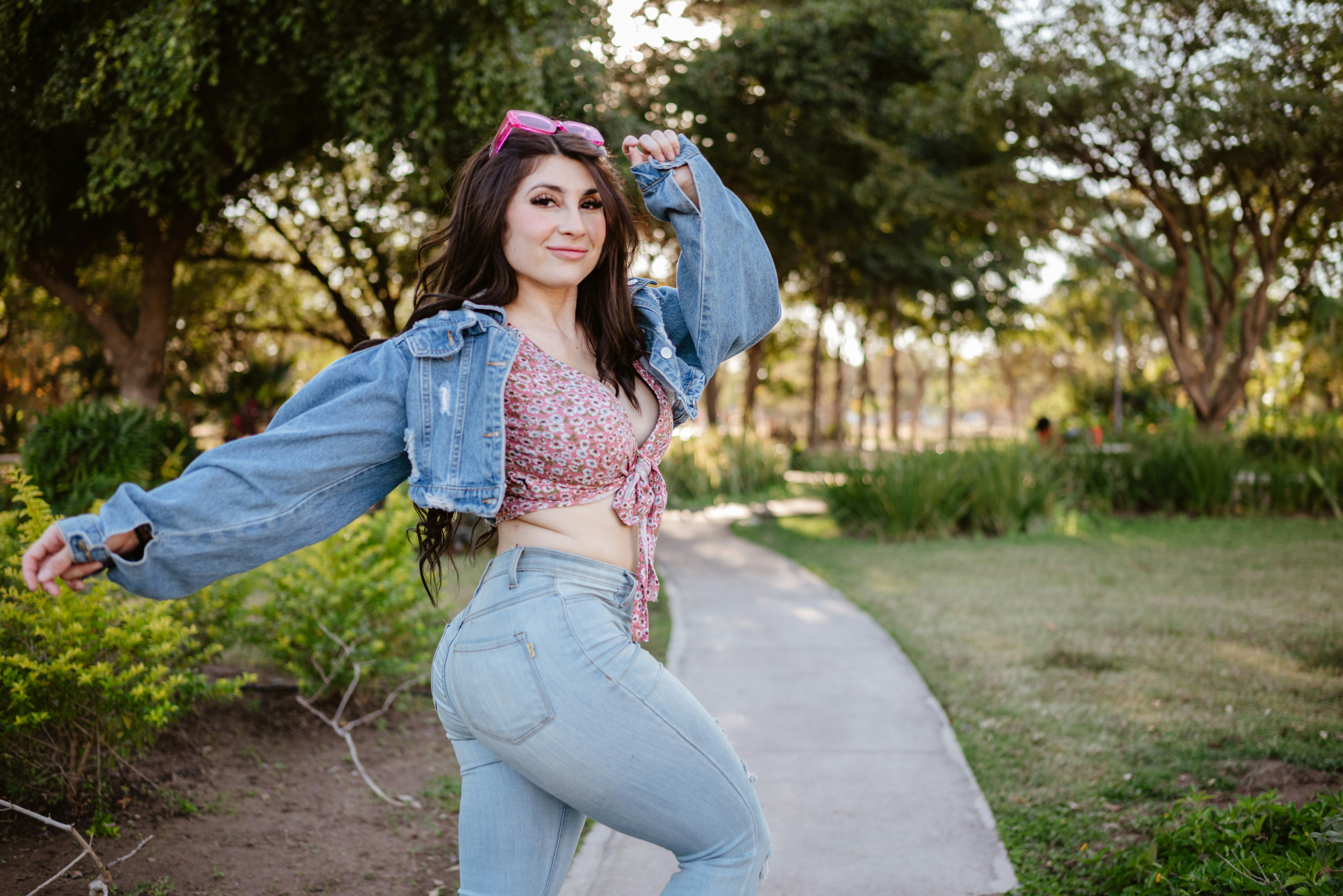 Sunlit Steps: A Confident Pose in Denim and Florals