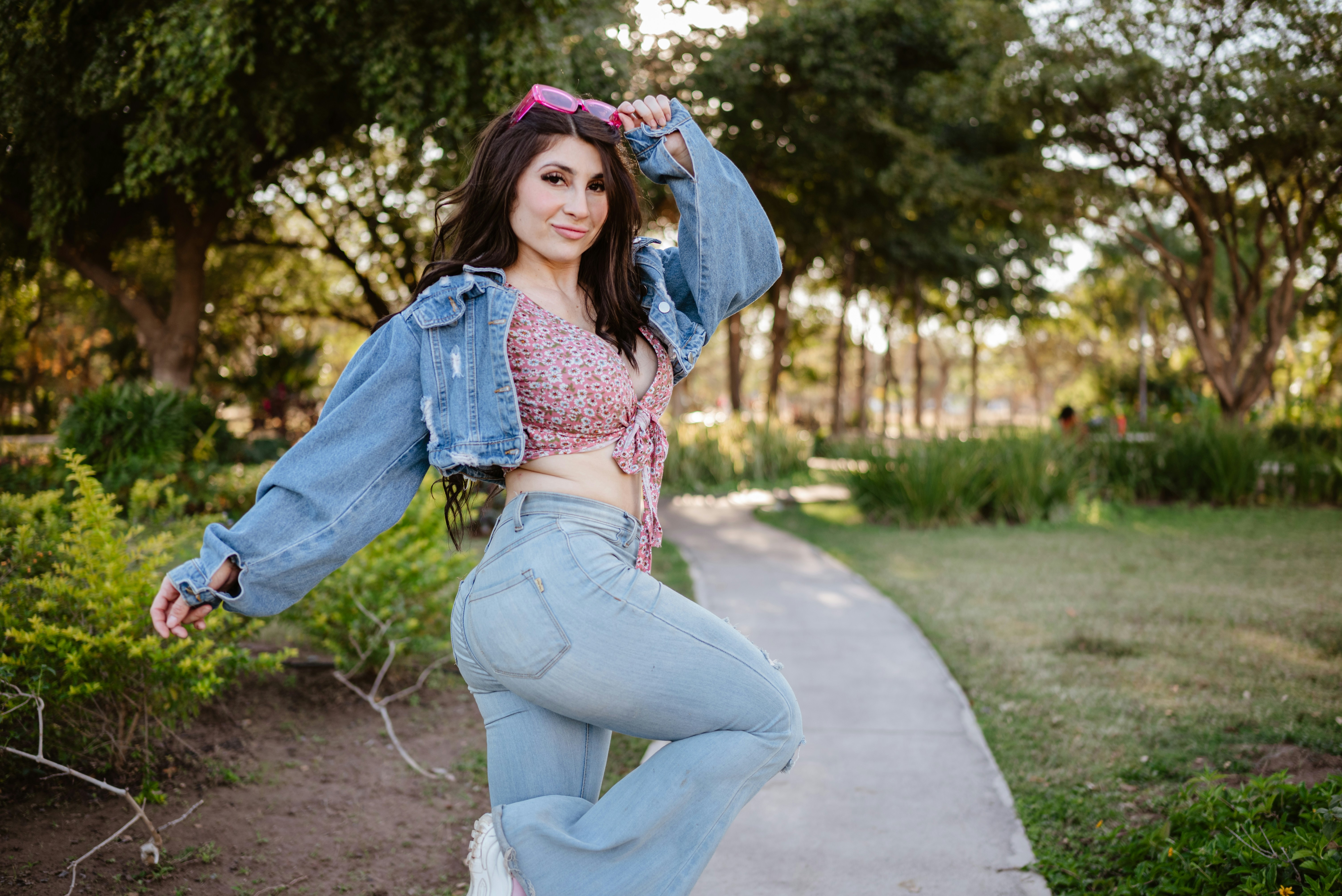 Sunlit Confidence: A Ballet of Denim and Flowered Pink