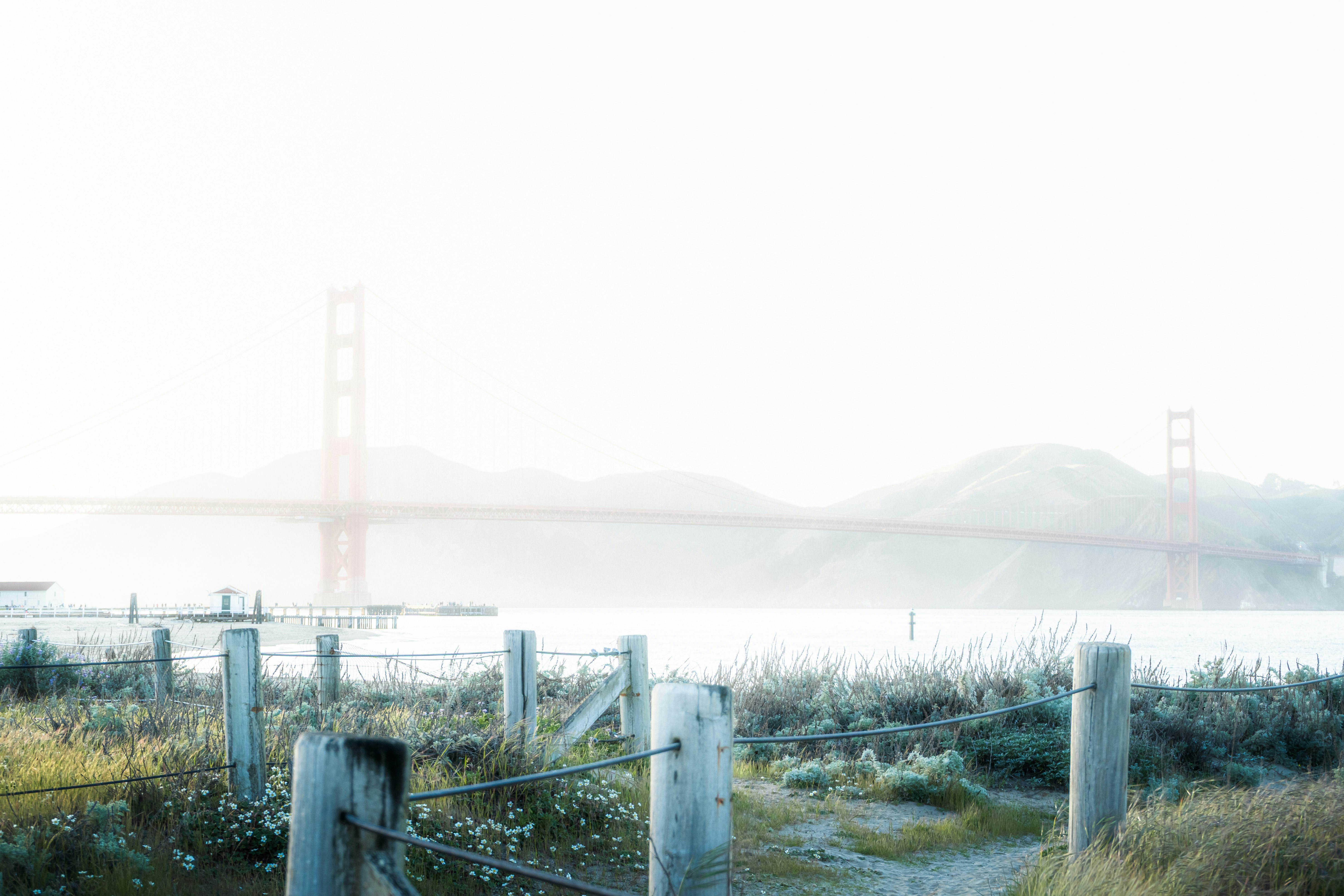 Fog Over the Golden Gate: Fence Lines and Distant Towers