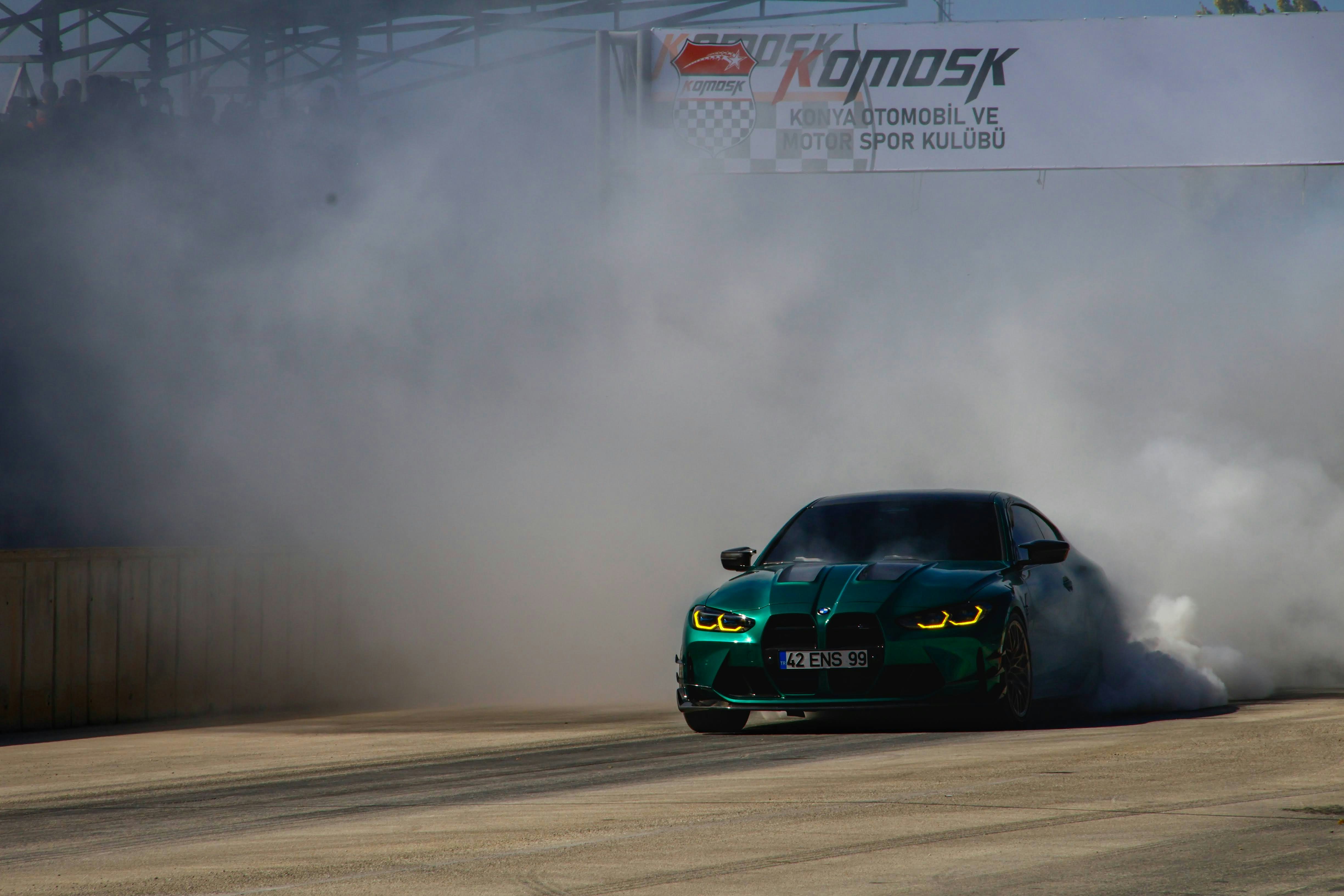 Green Drift: A Ford Mustang Sprints Through Smoke on the Raceway