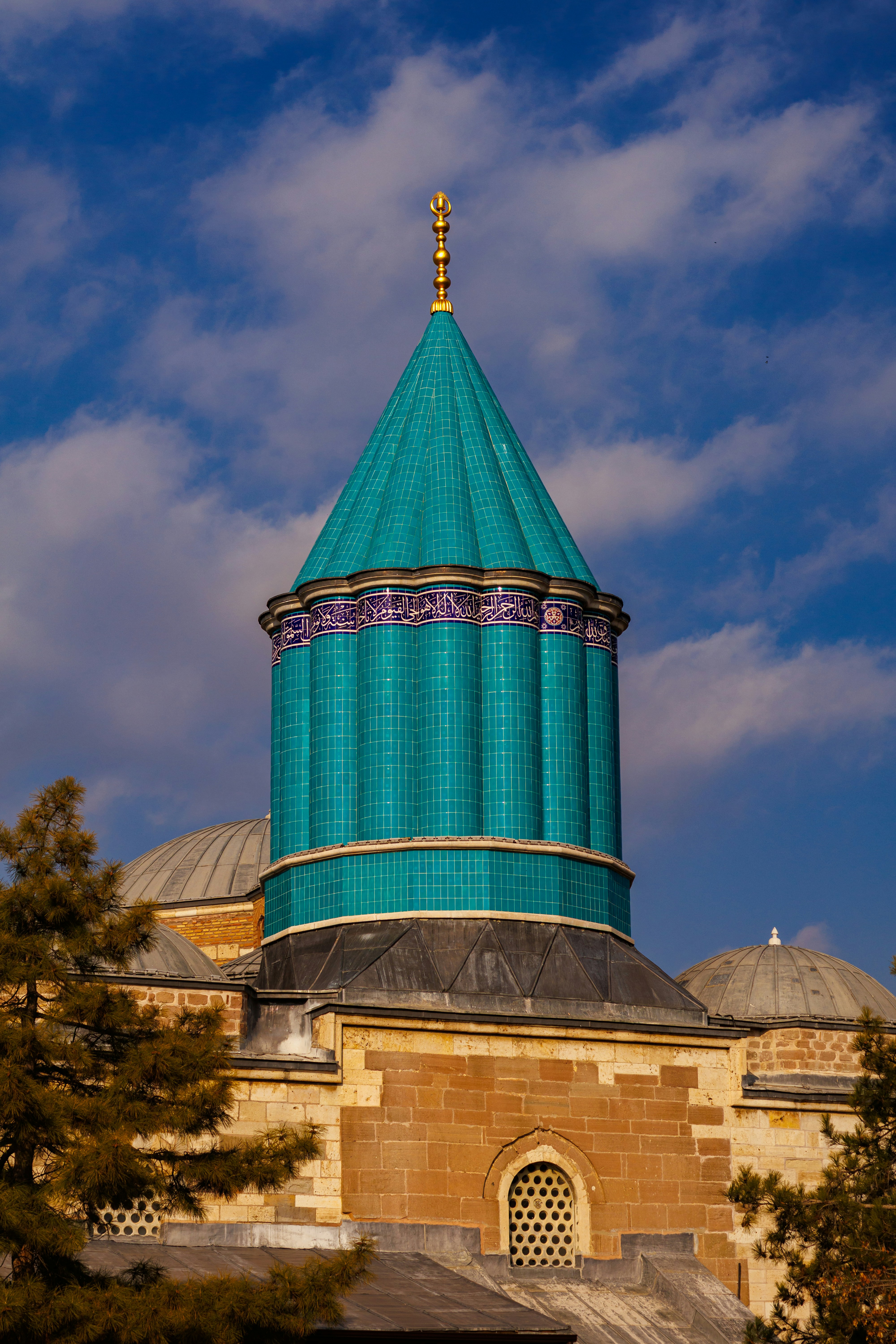 Turquoise Roof Spire Against a Clear Sky