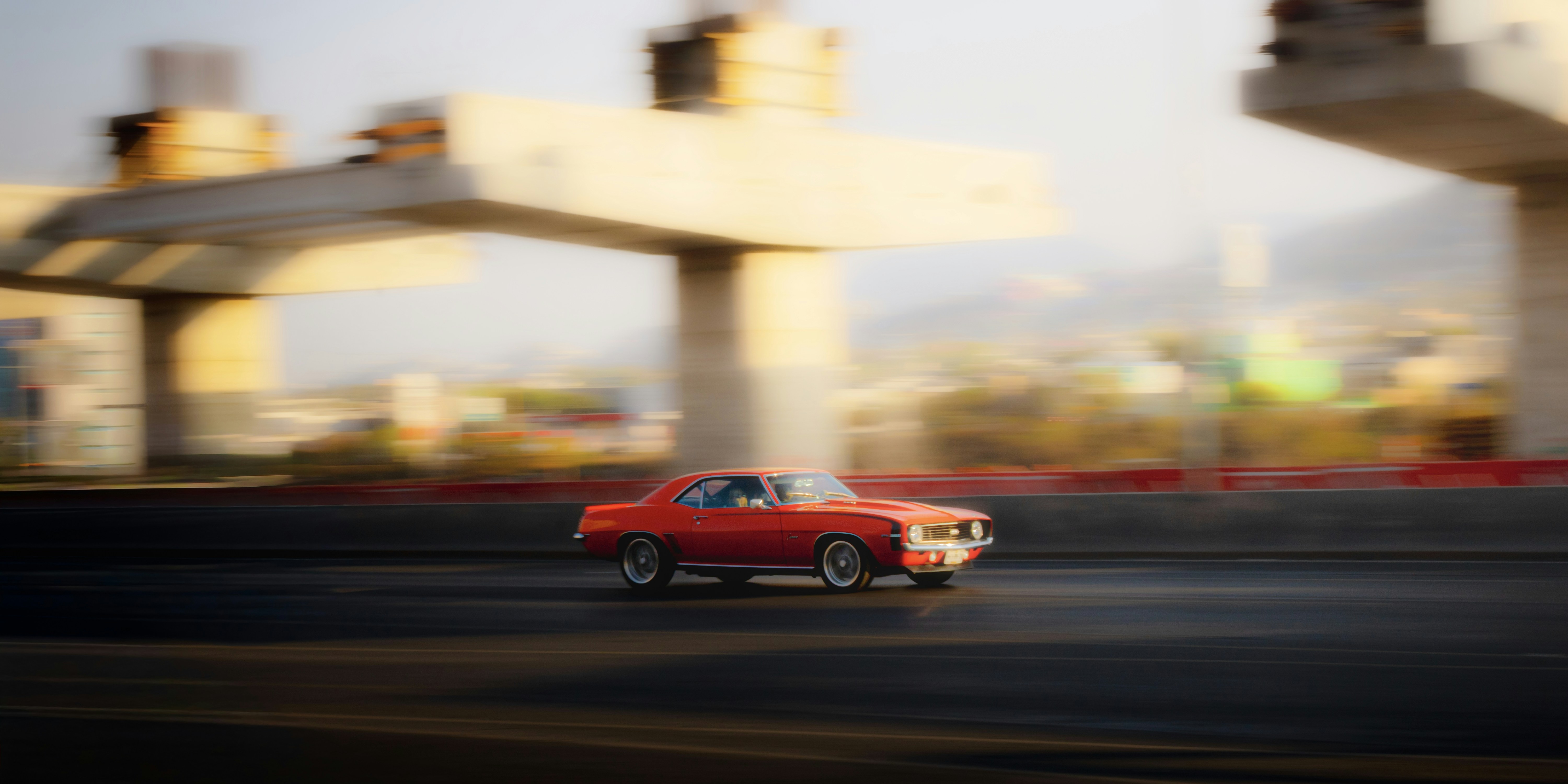 Blazing Red Classic Car in a City Sweep