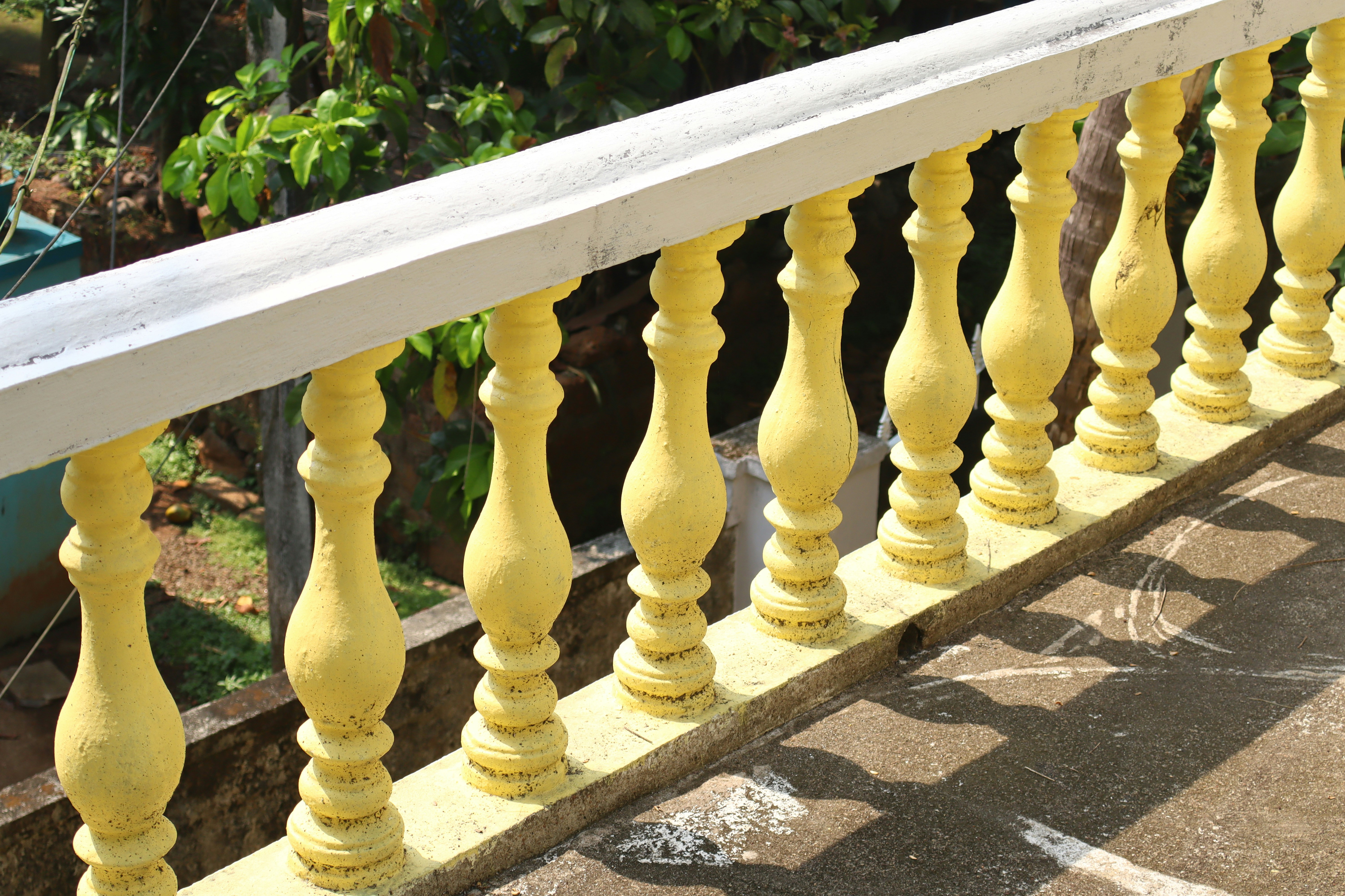 Sunlit Balustrade: Repeating Silhouettes Along a Concrete Terrace