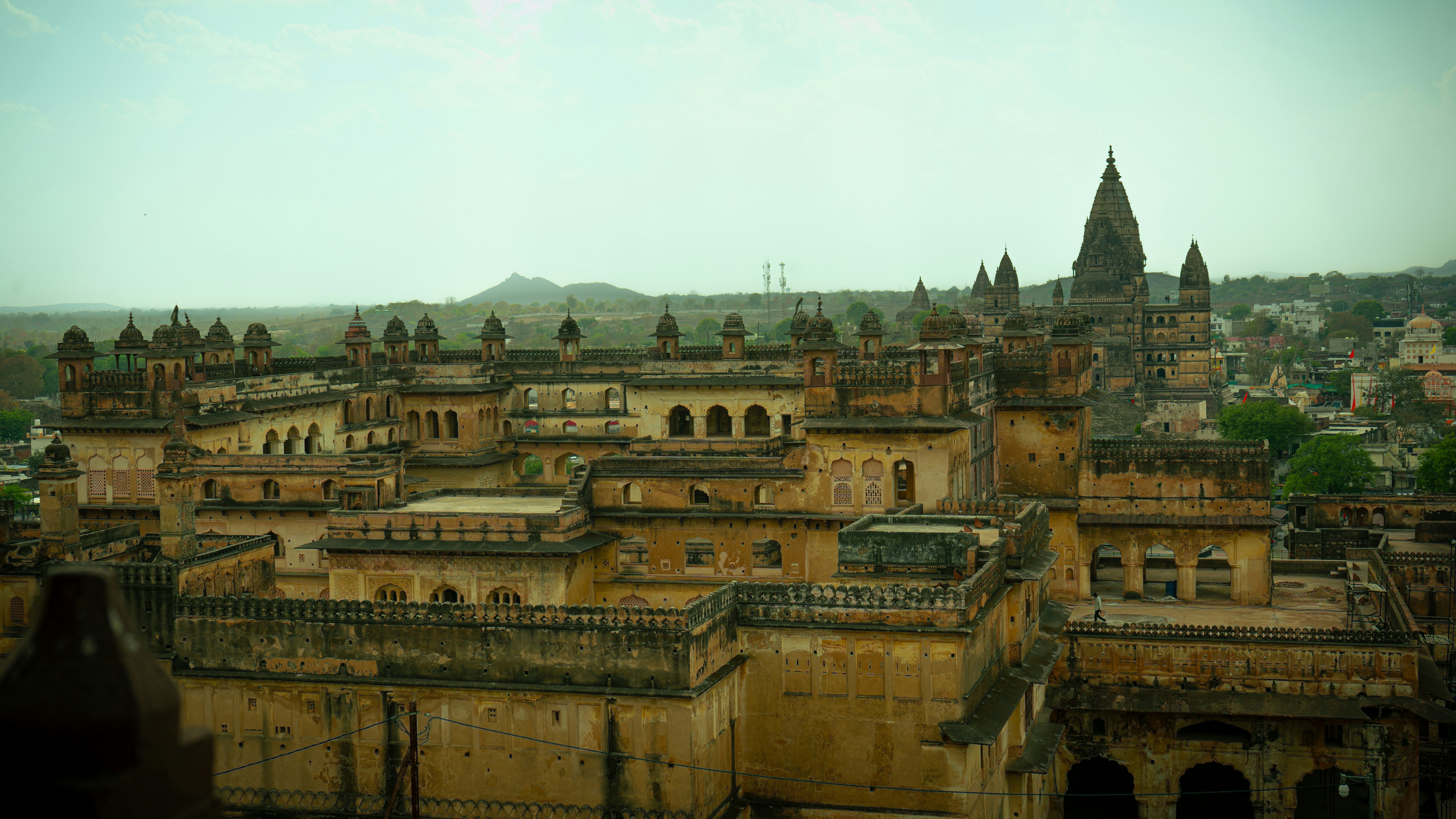Rising Fortresses Under a Distant Temple Cloud