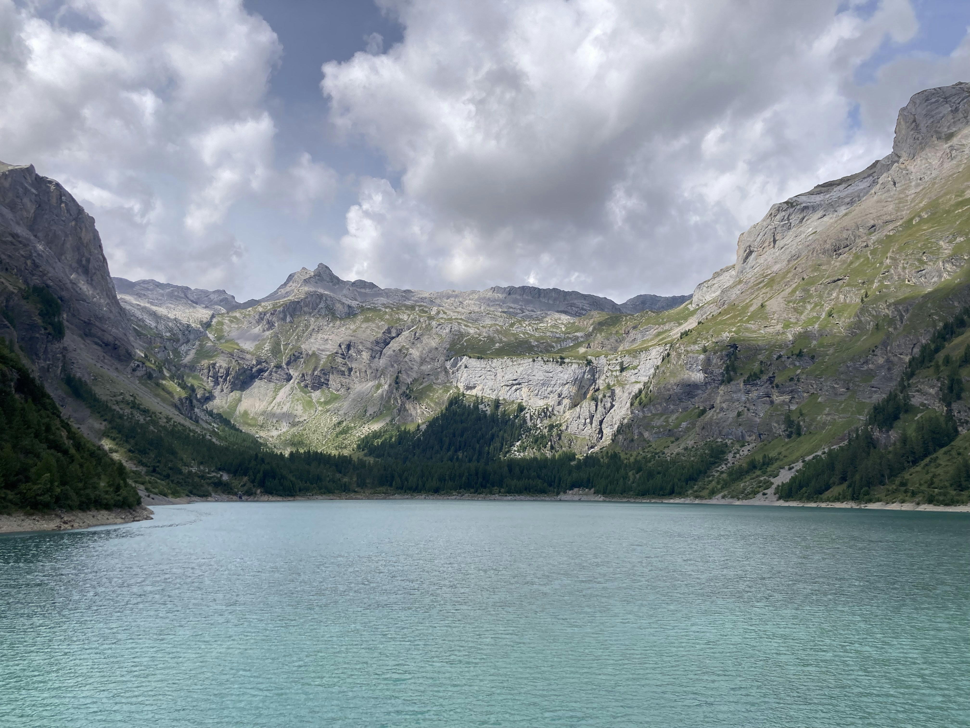 Azure Caldera: A Mountain Lake Surrounded by Sky and Stone