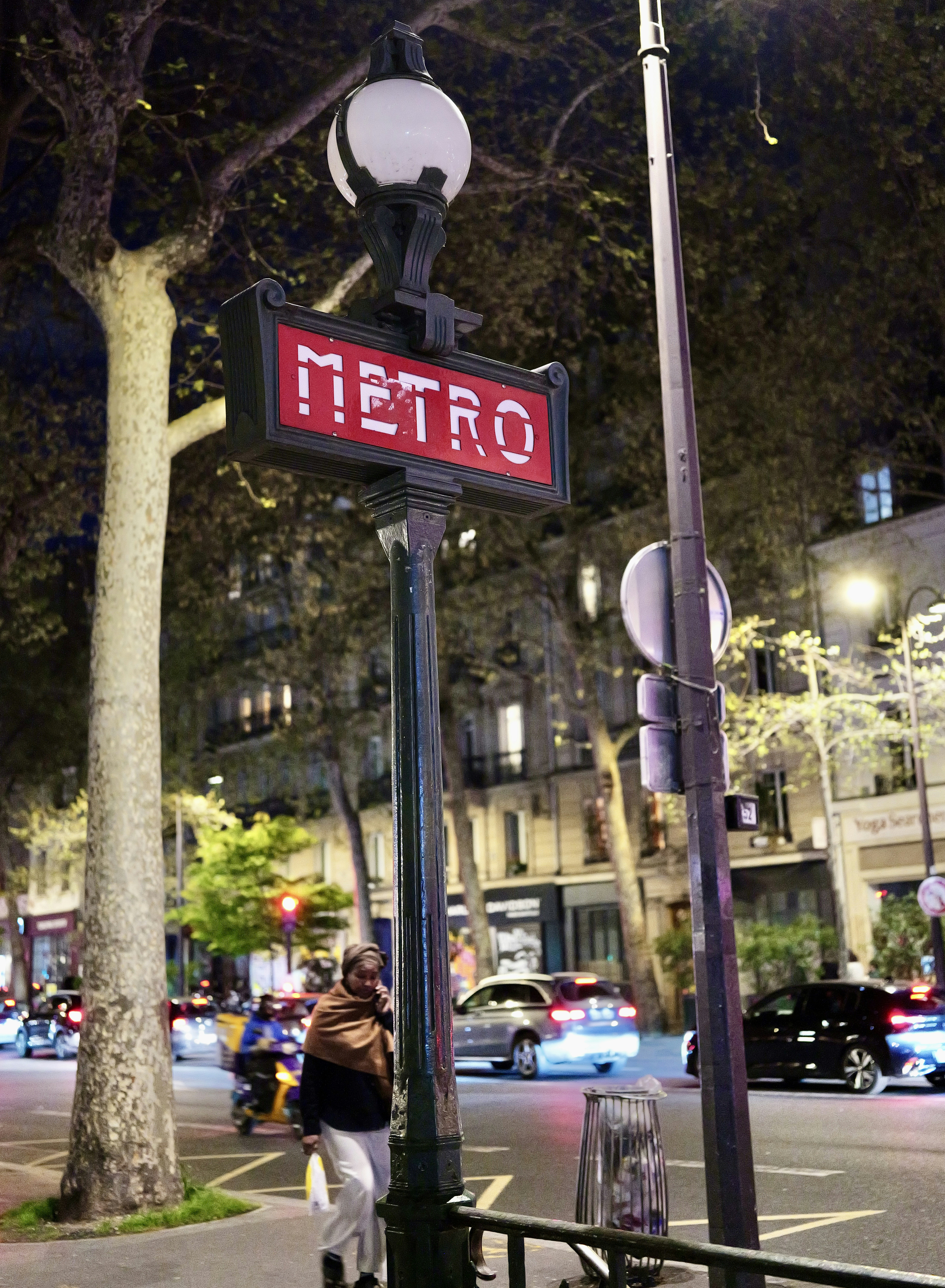 Nighttime Metro Sign Abloom with City Light