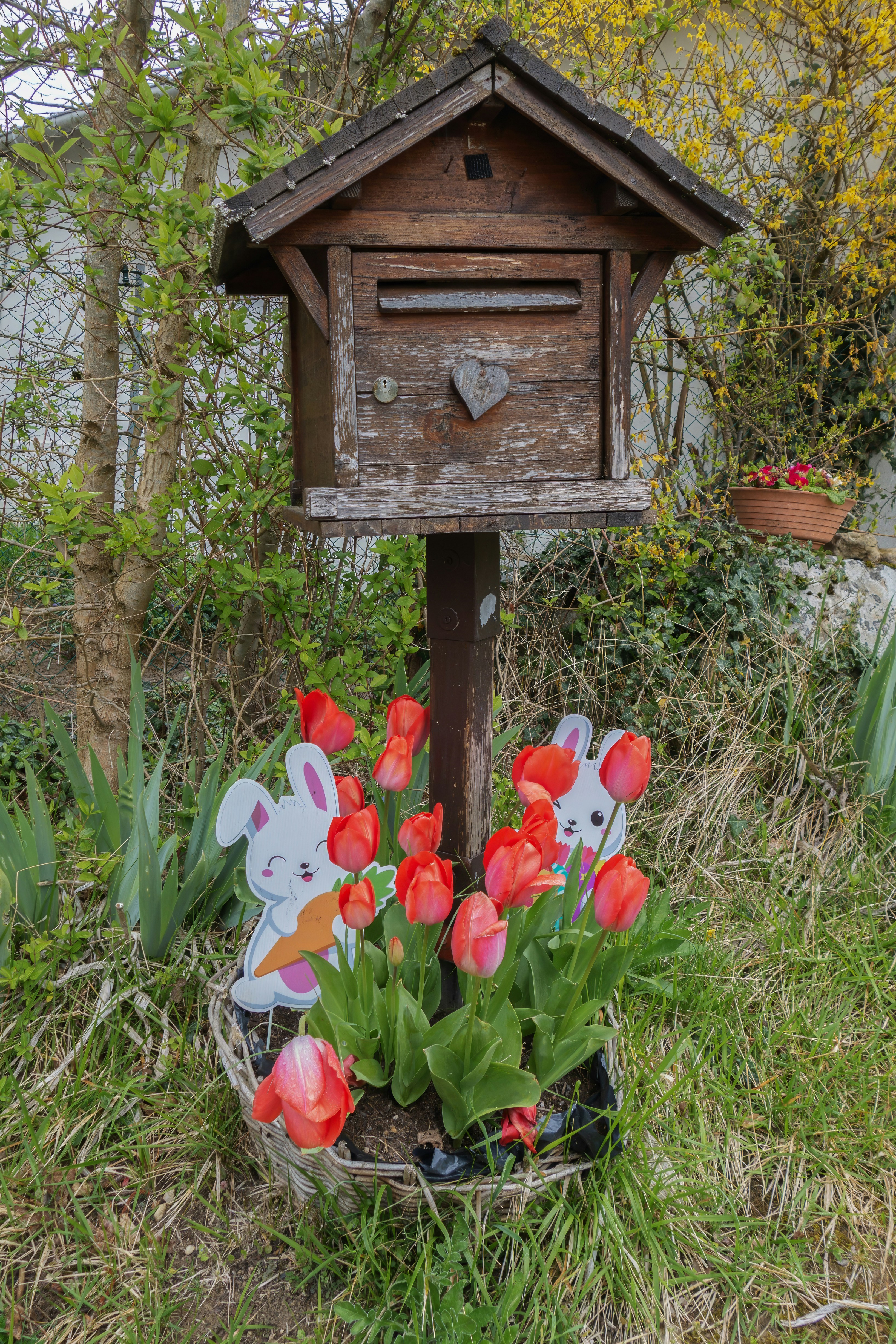 Nest Box Garden: Wooden Chest, Tulips, and Cardboard Rabbits