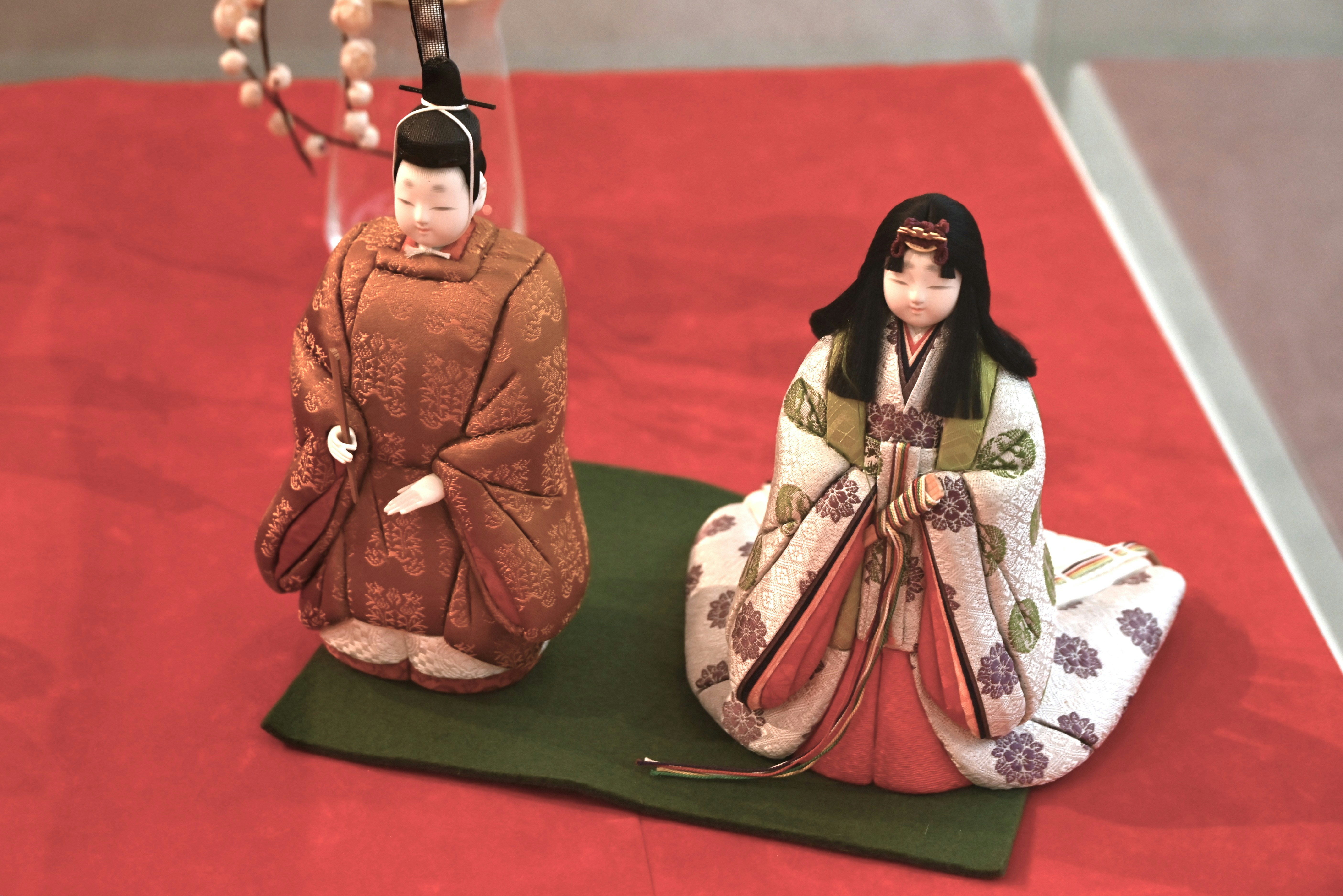 Miniature Hina Dolls on a Red Stage