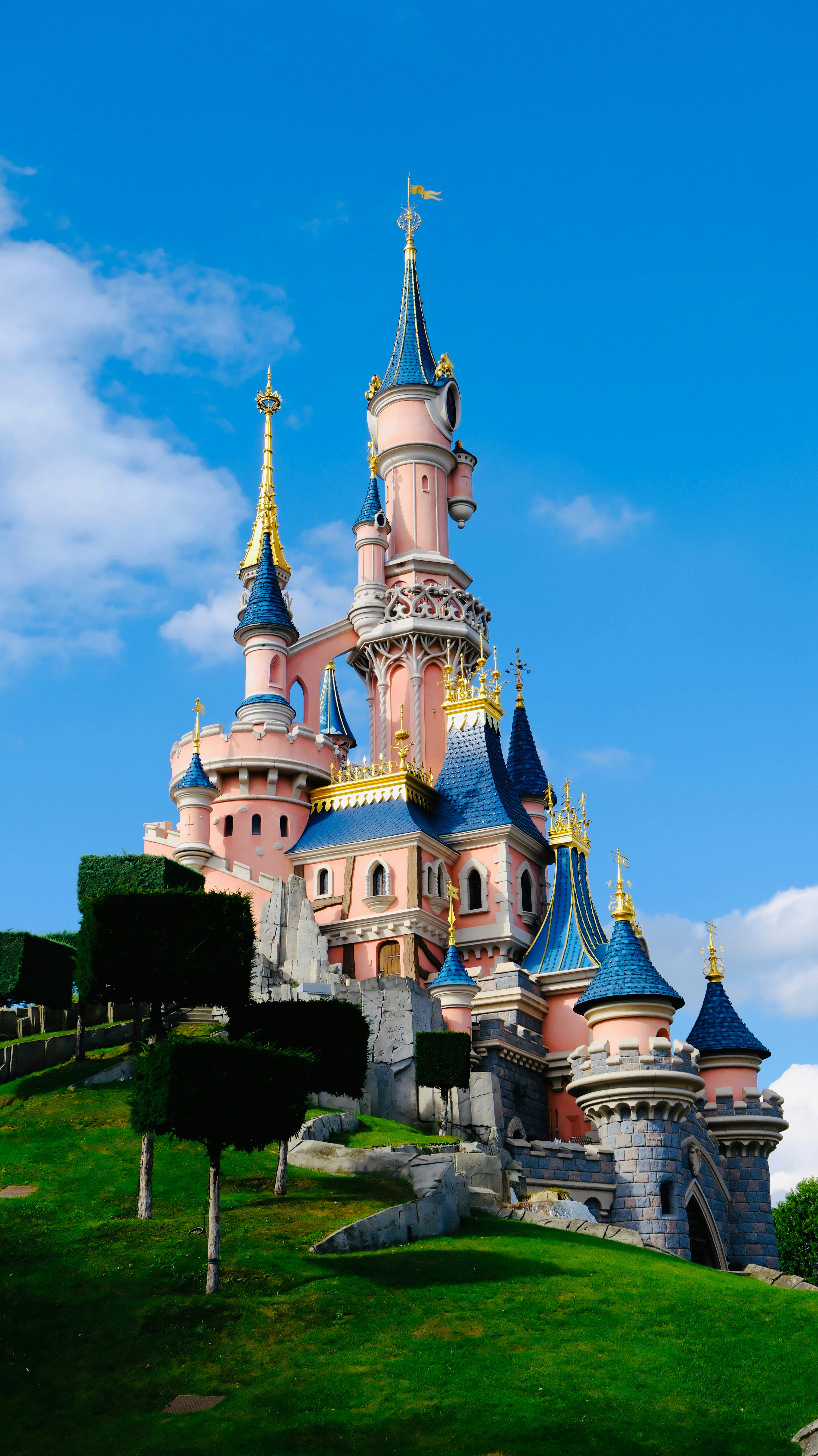 Whimsical Spires: A Pink Castle Reaching for the Sky