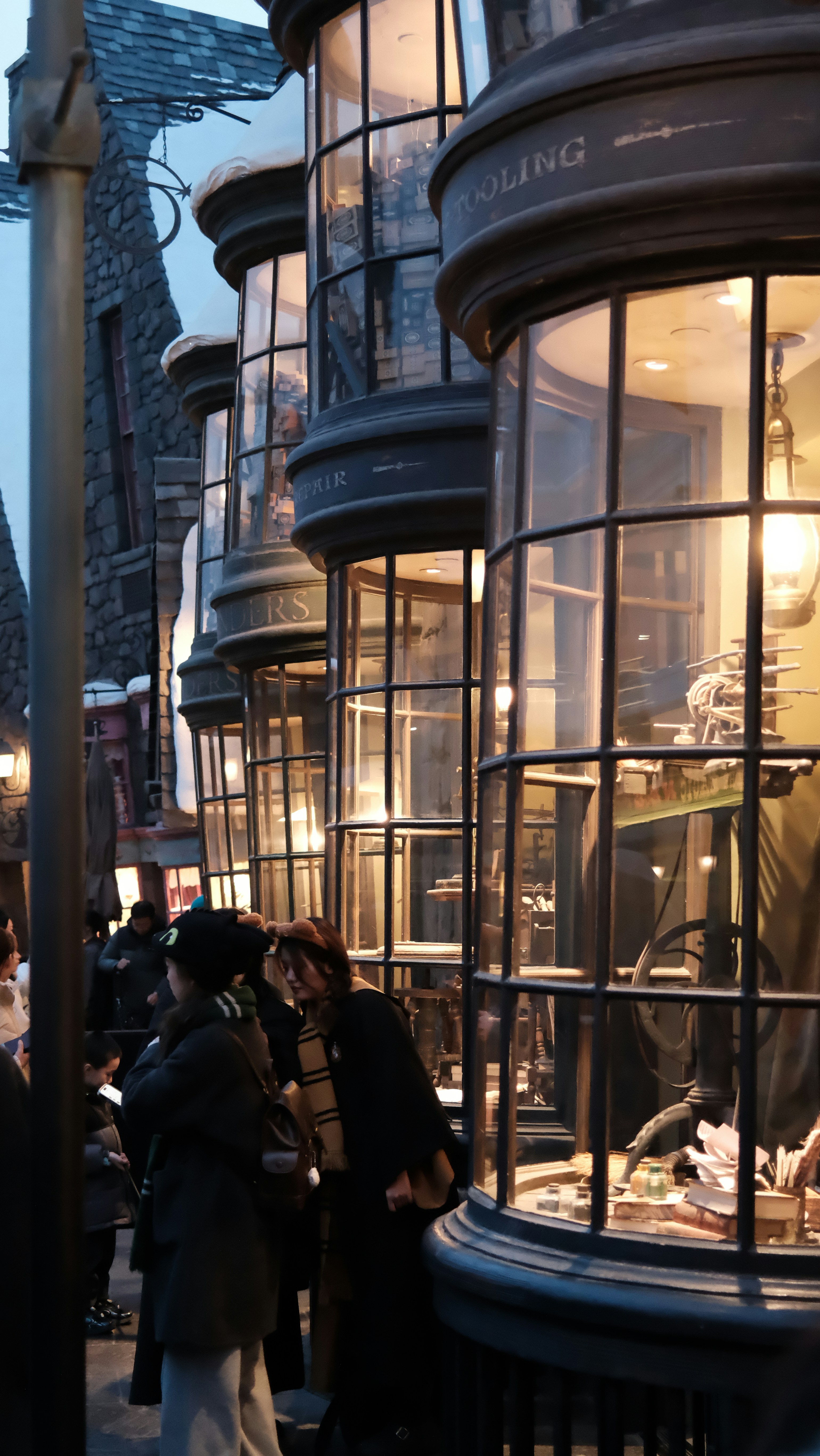Lantern-lit Windows and Quiet Conversations Outside a Curio Shop