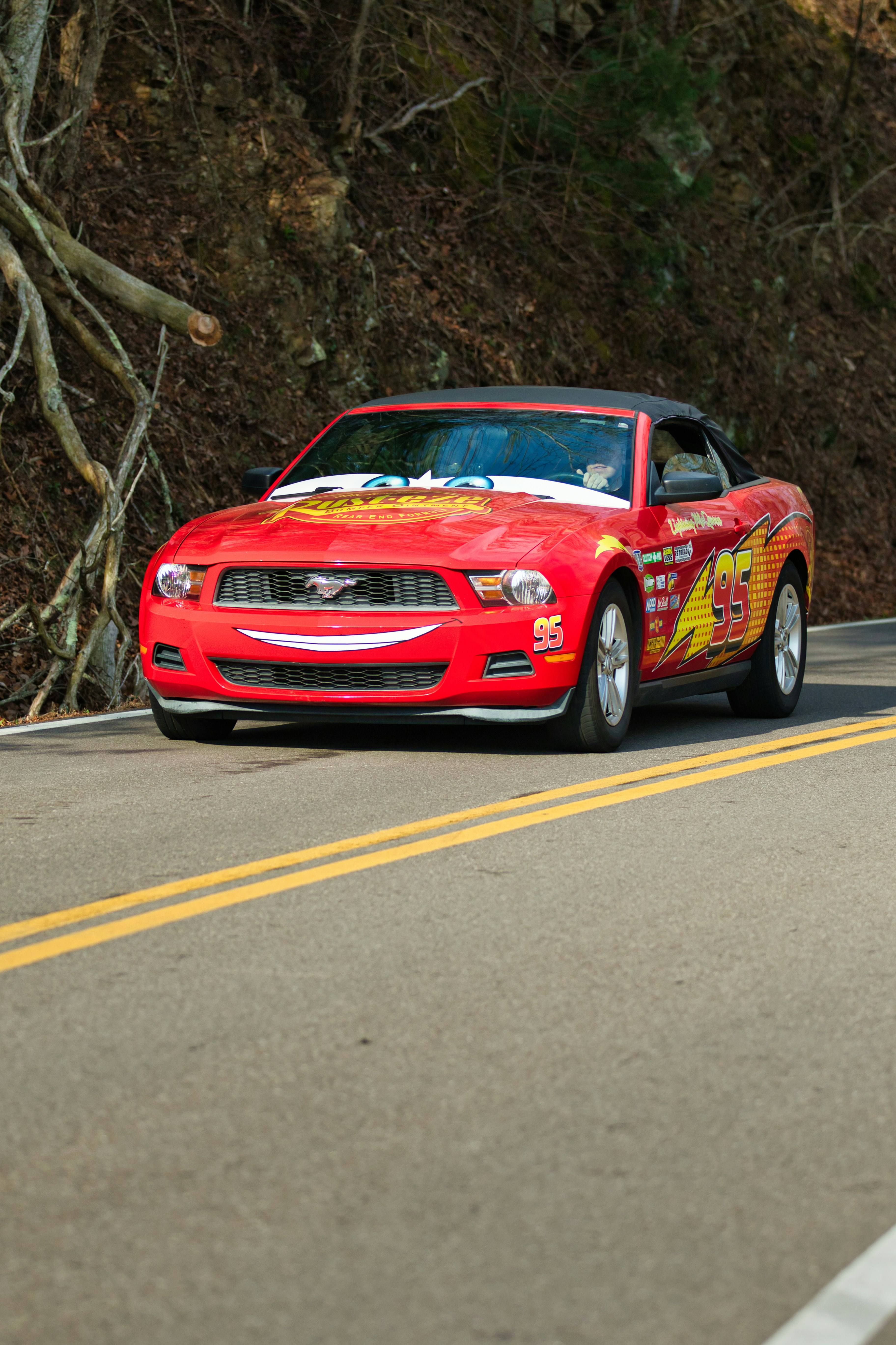 Red Lightning on Winding Road: A NASCAR‑style Mustang in Motion