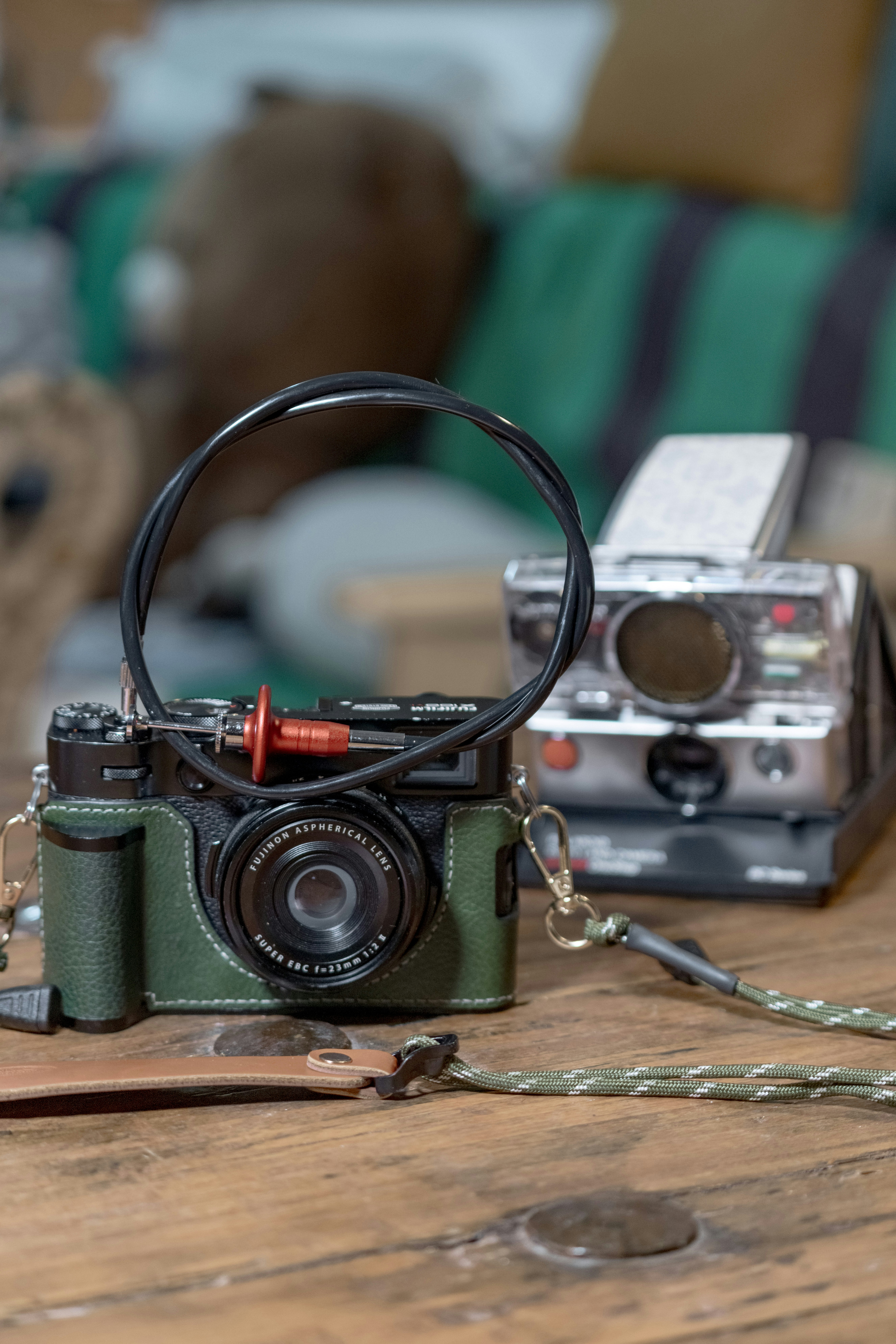 Two Vintage Nikon-esque Range: A Green Leather Compact with Shuttered Backdrop