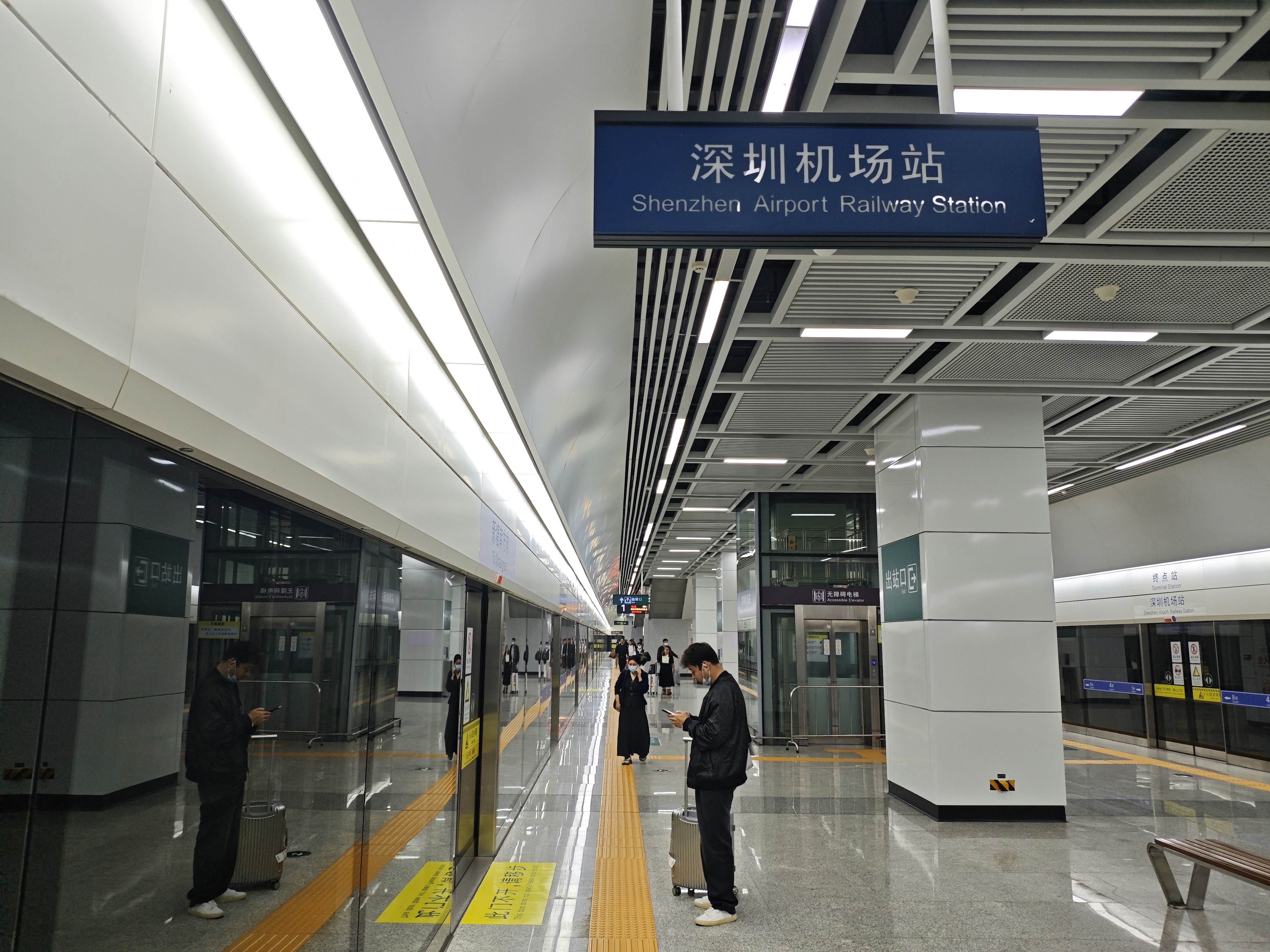 Shenzhen airport railway station platform with people waiting