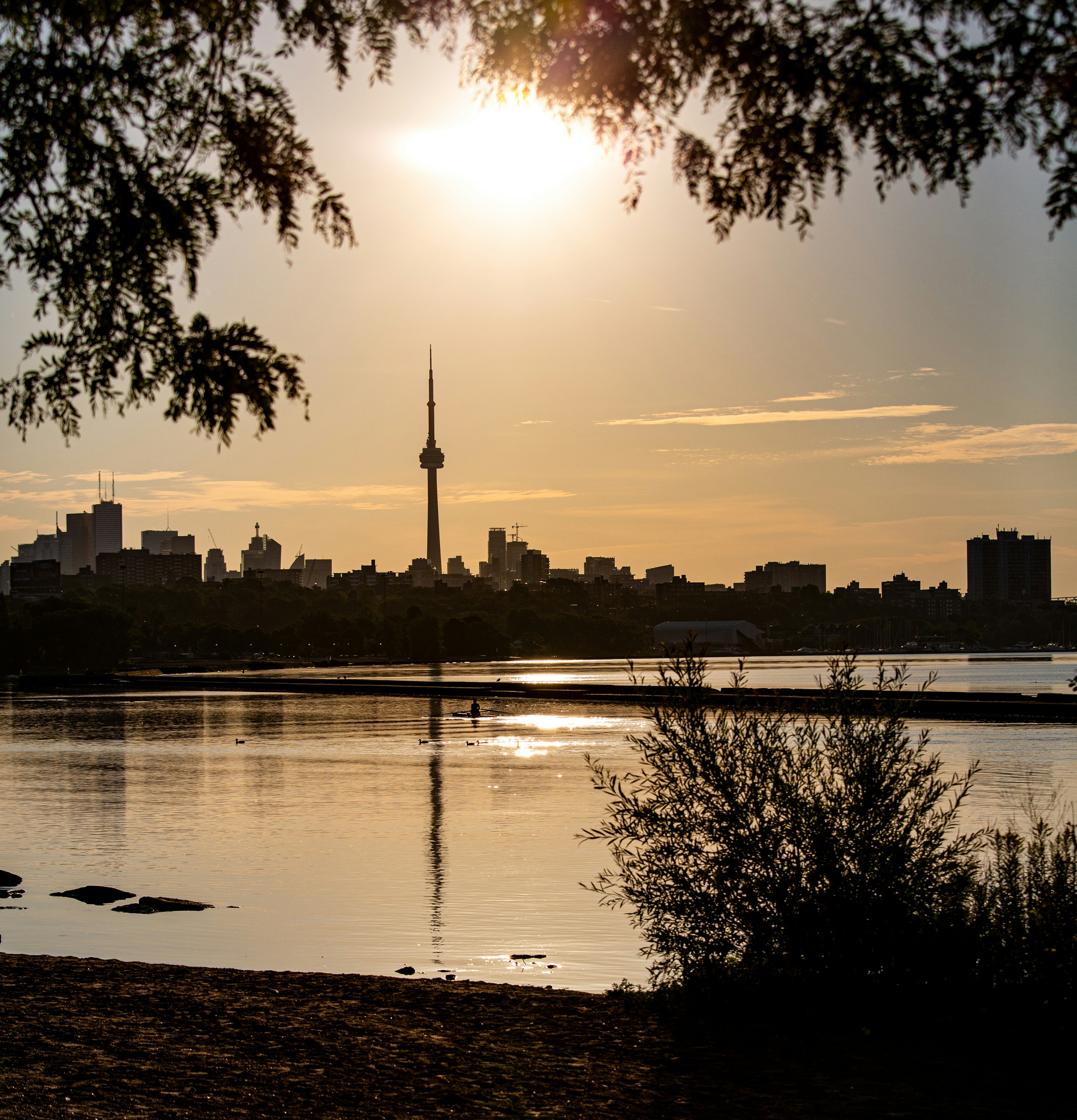 Dusk over the Calm River with a Silhouette of the City