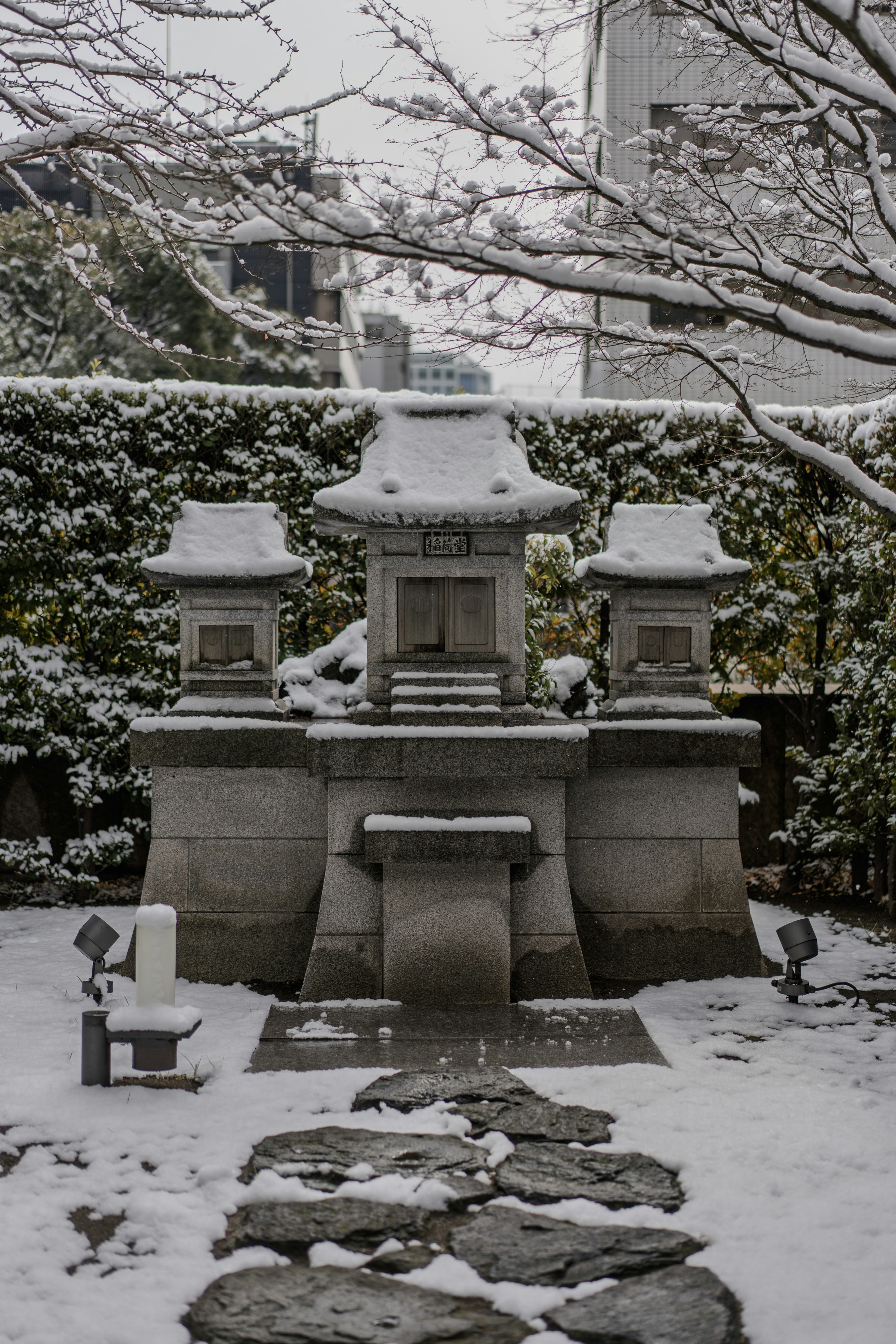 Snow-dusted Shinto Shrine Ceremony in an Urban Garden