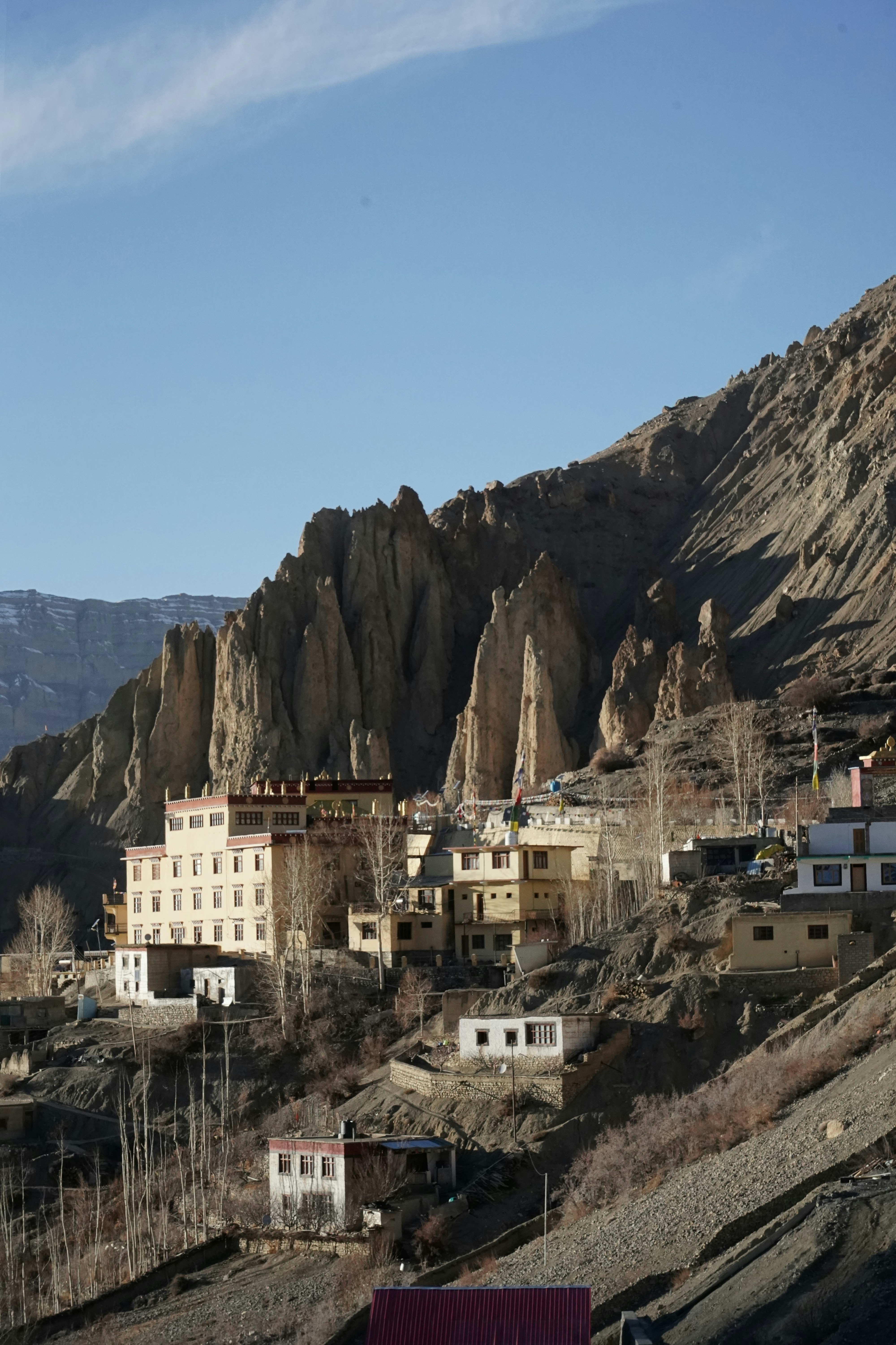 Cliffside Village Nestled Under Granite Peaks