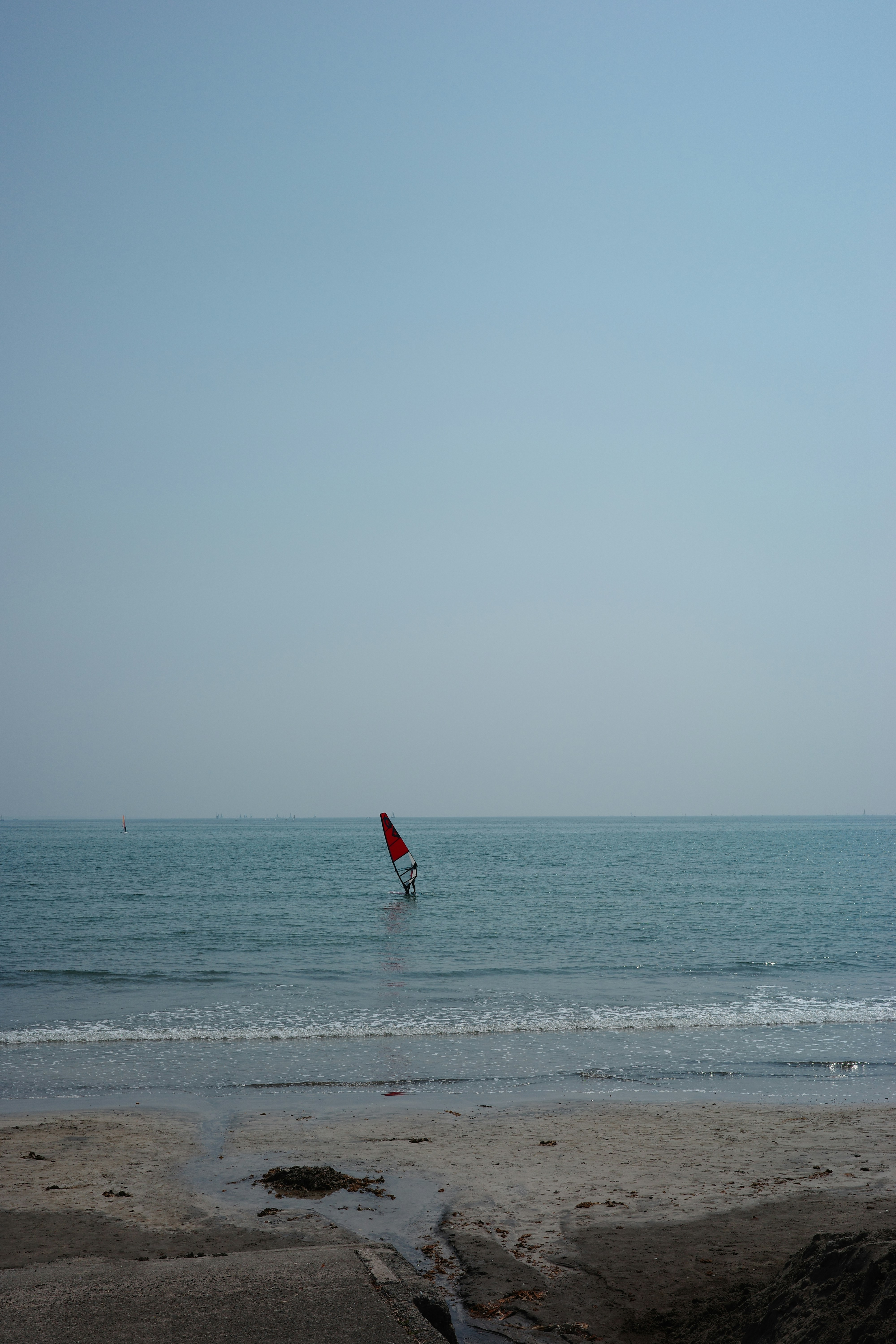 Red Sail at the Horizon: Quiet Boundary Between Sea and Sky