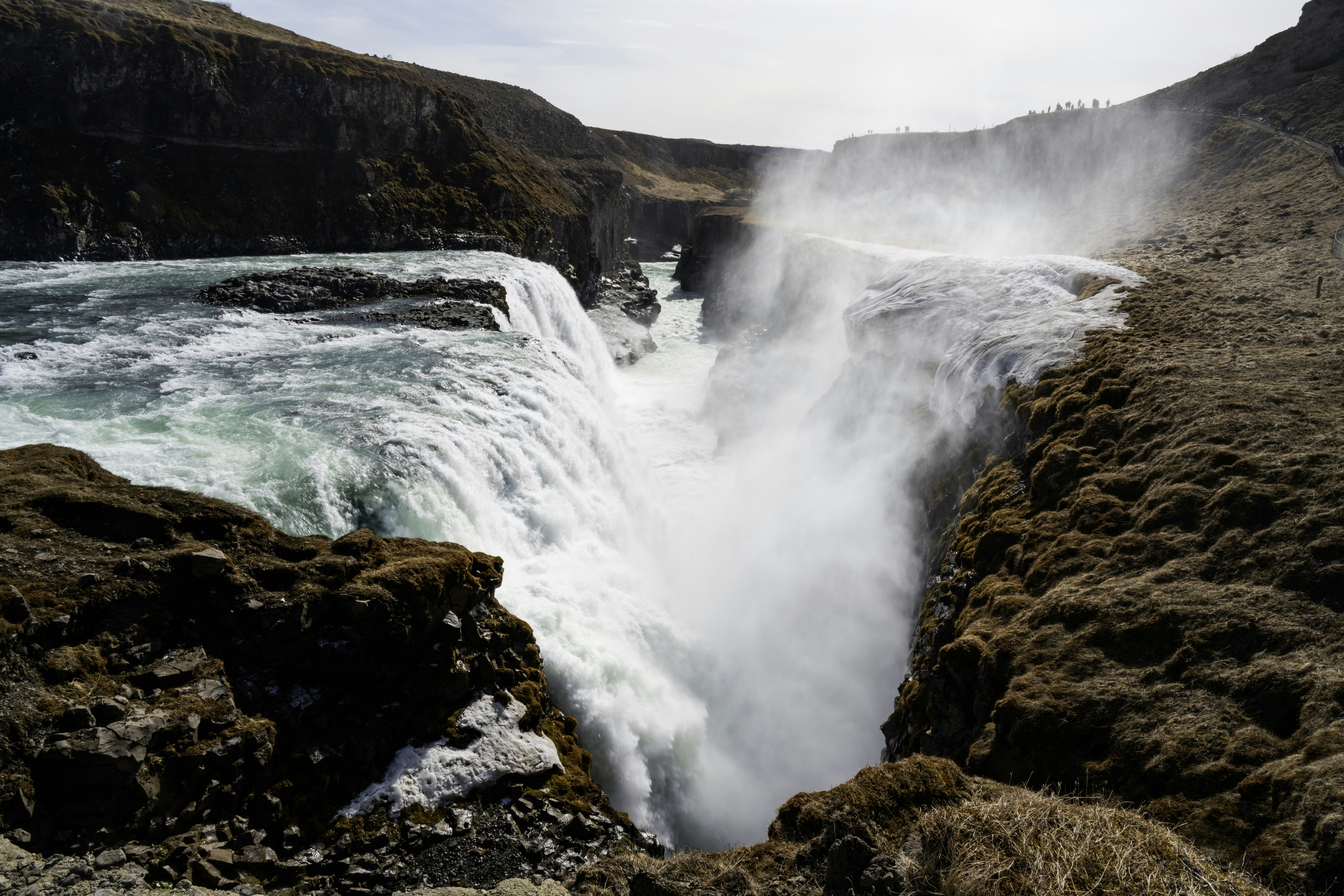 Rushing Canyon: Waterfall Hurling Toward the Gorge