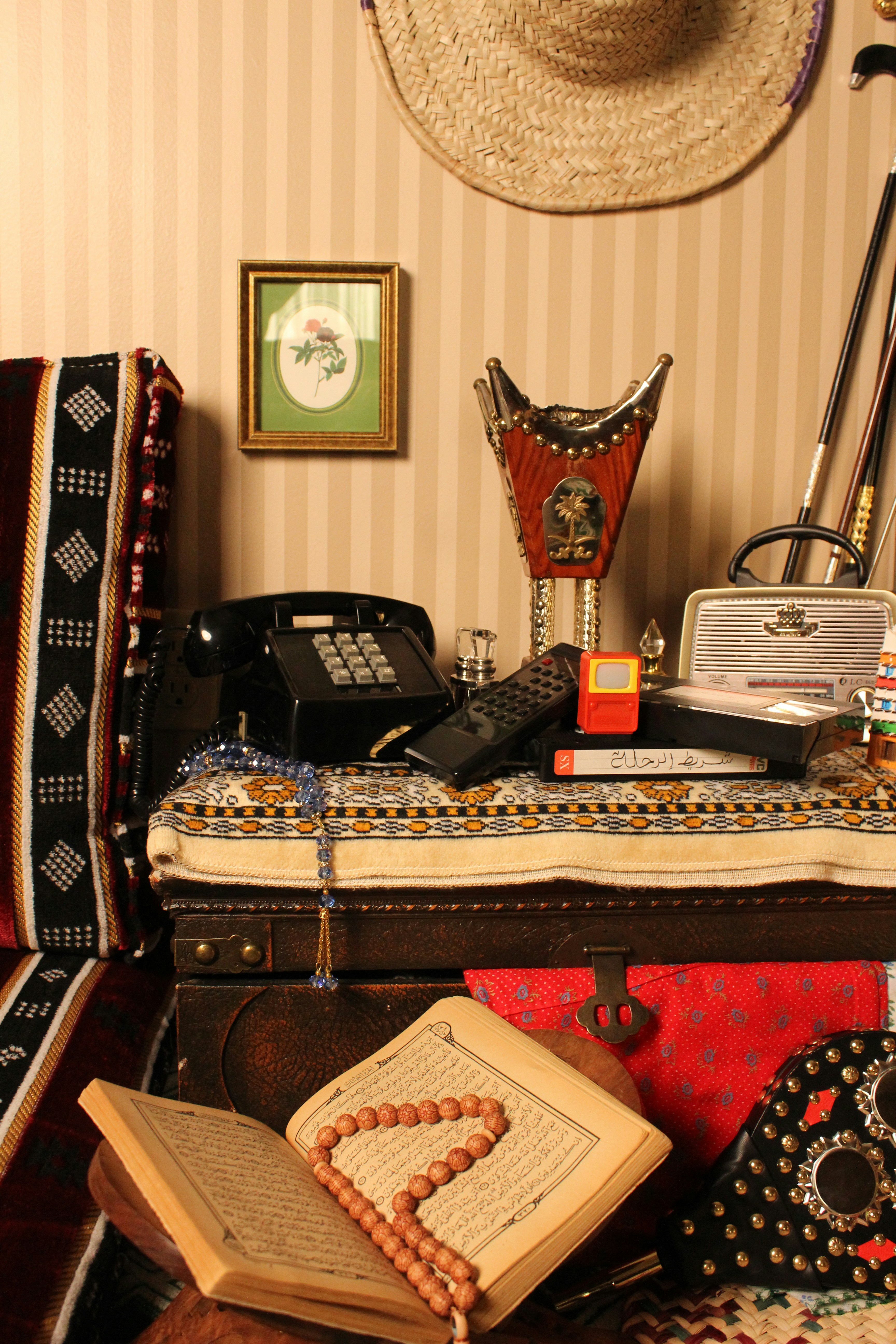 Vintage Corner: An Antique Still Life with Telephones, Textiles, and a Beaded Prayer Ring