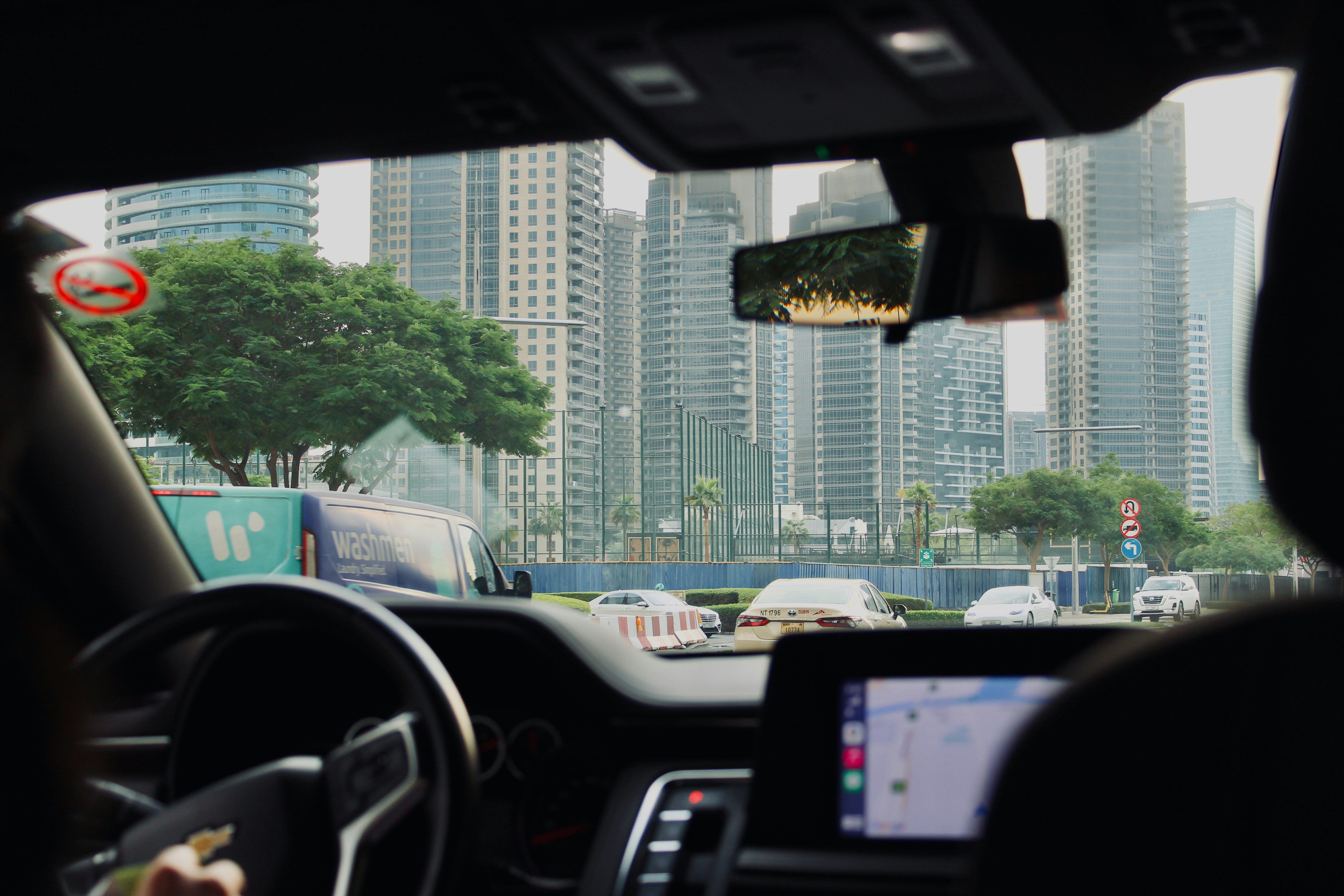 City Drive: Glassy Skyline Through a Car Window