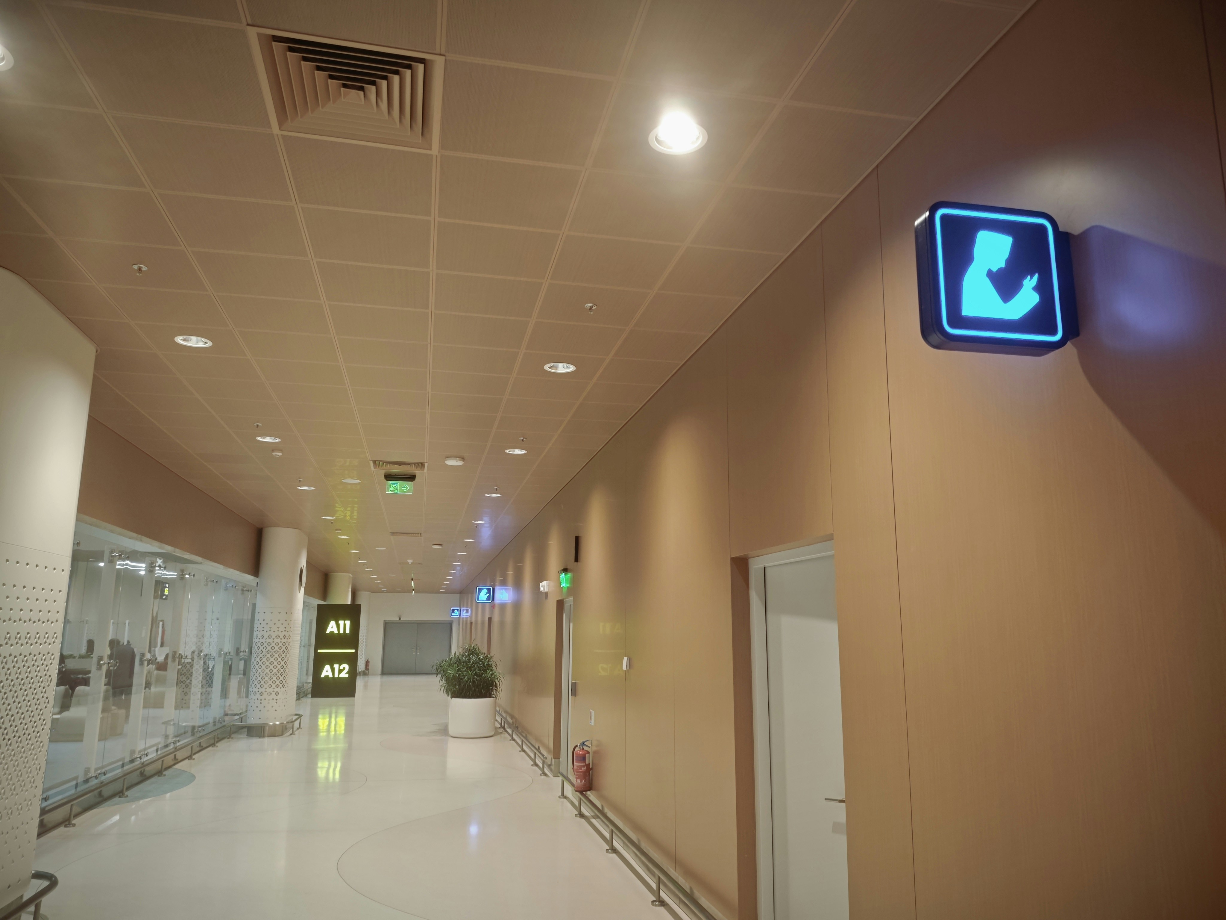 Quiet Hospital Corridor with Blue Neon Sign