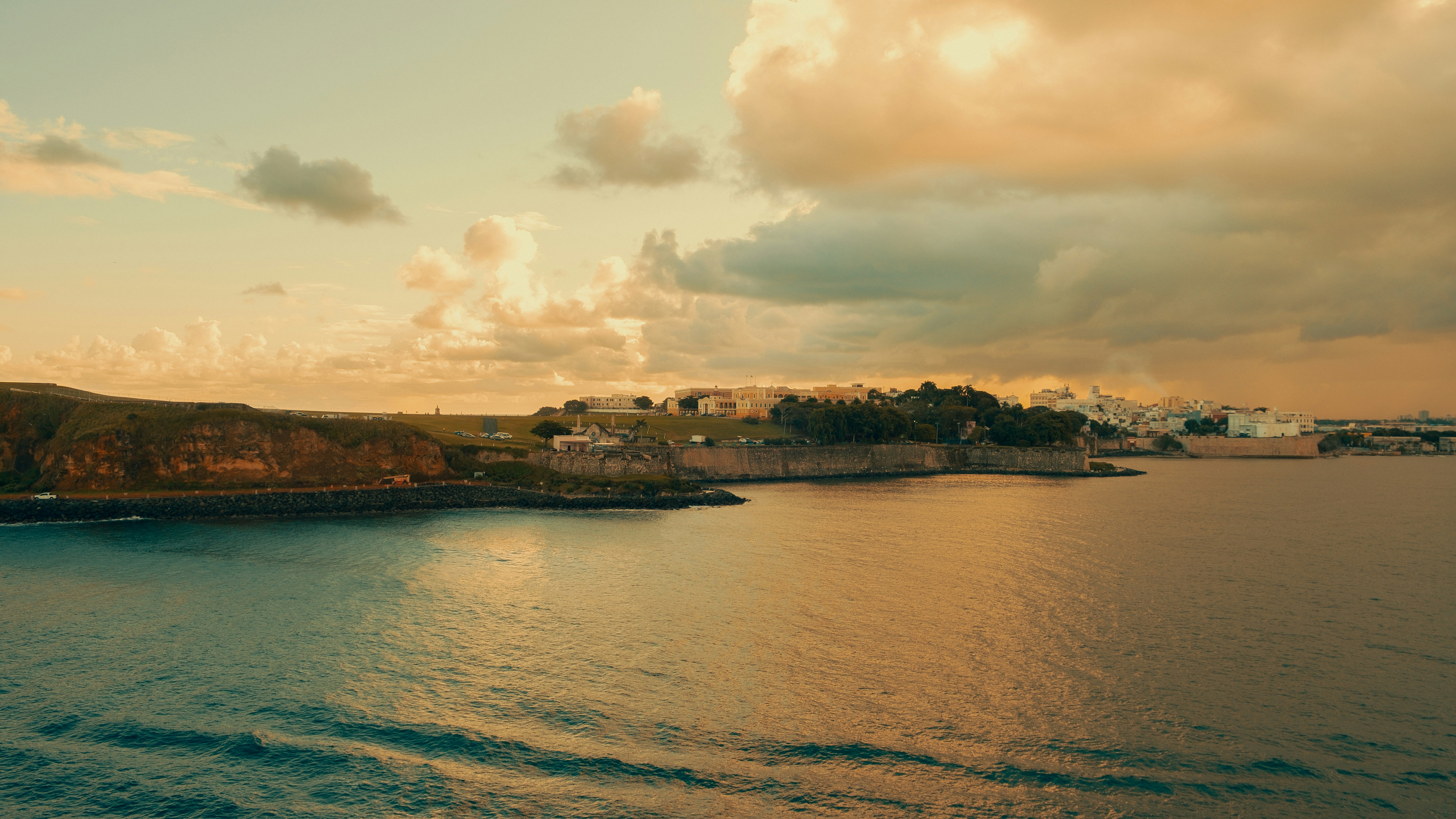 Golden Coastlines: A Quiet Harbor Under Sunset Skies