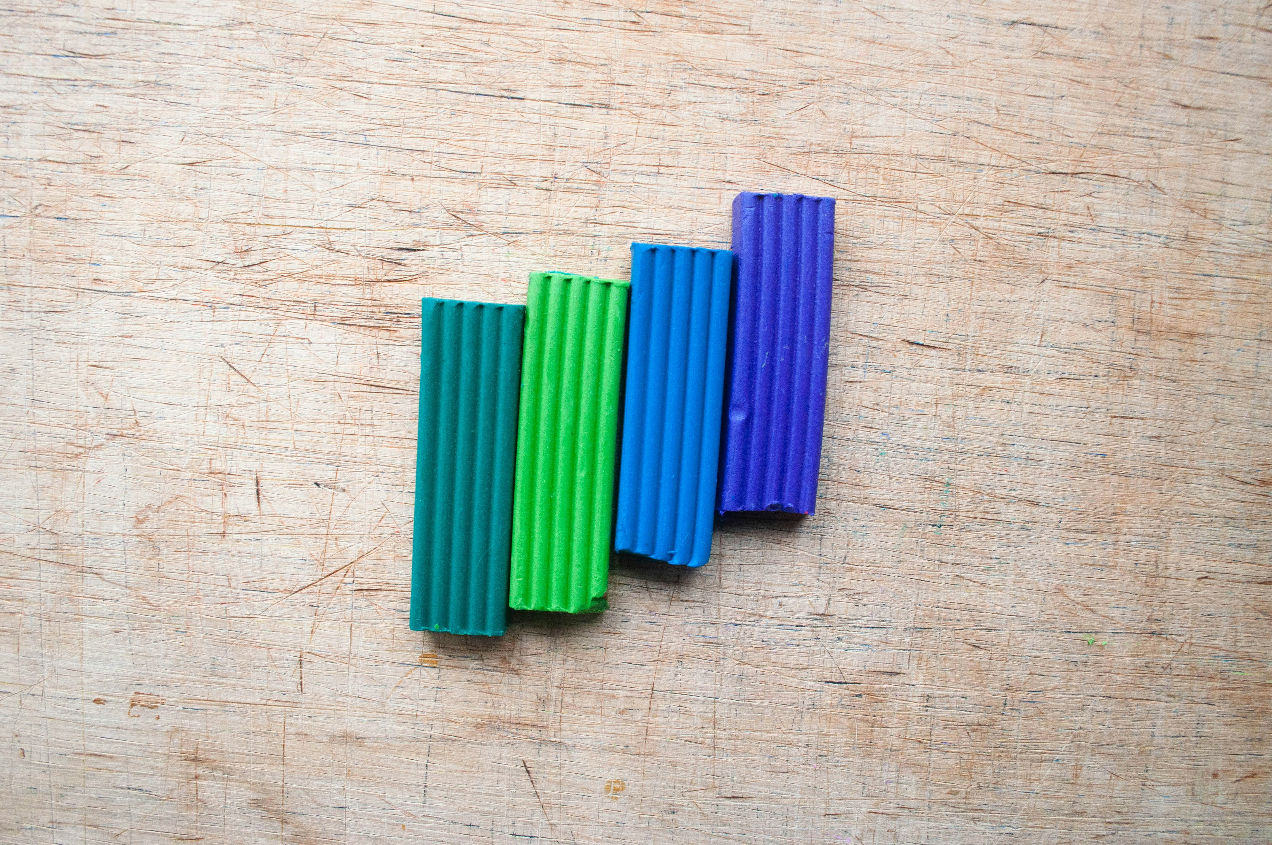 Colored polymer rods on a wooden tabletop