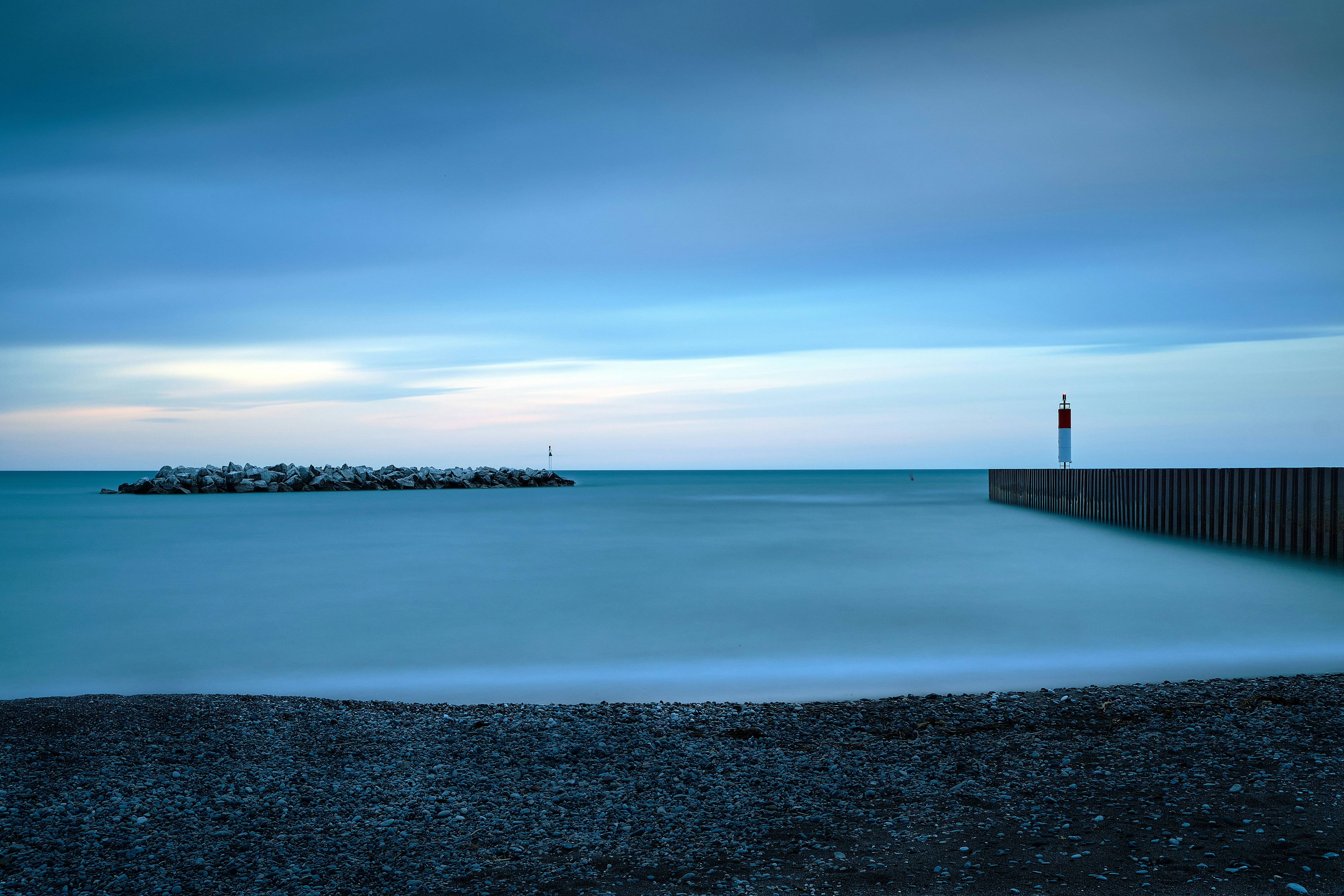Coastal Convergence: Jetty and Breakwater at Dusk