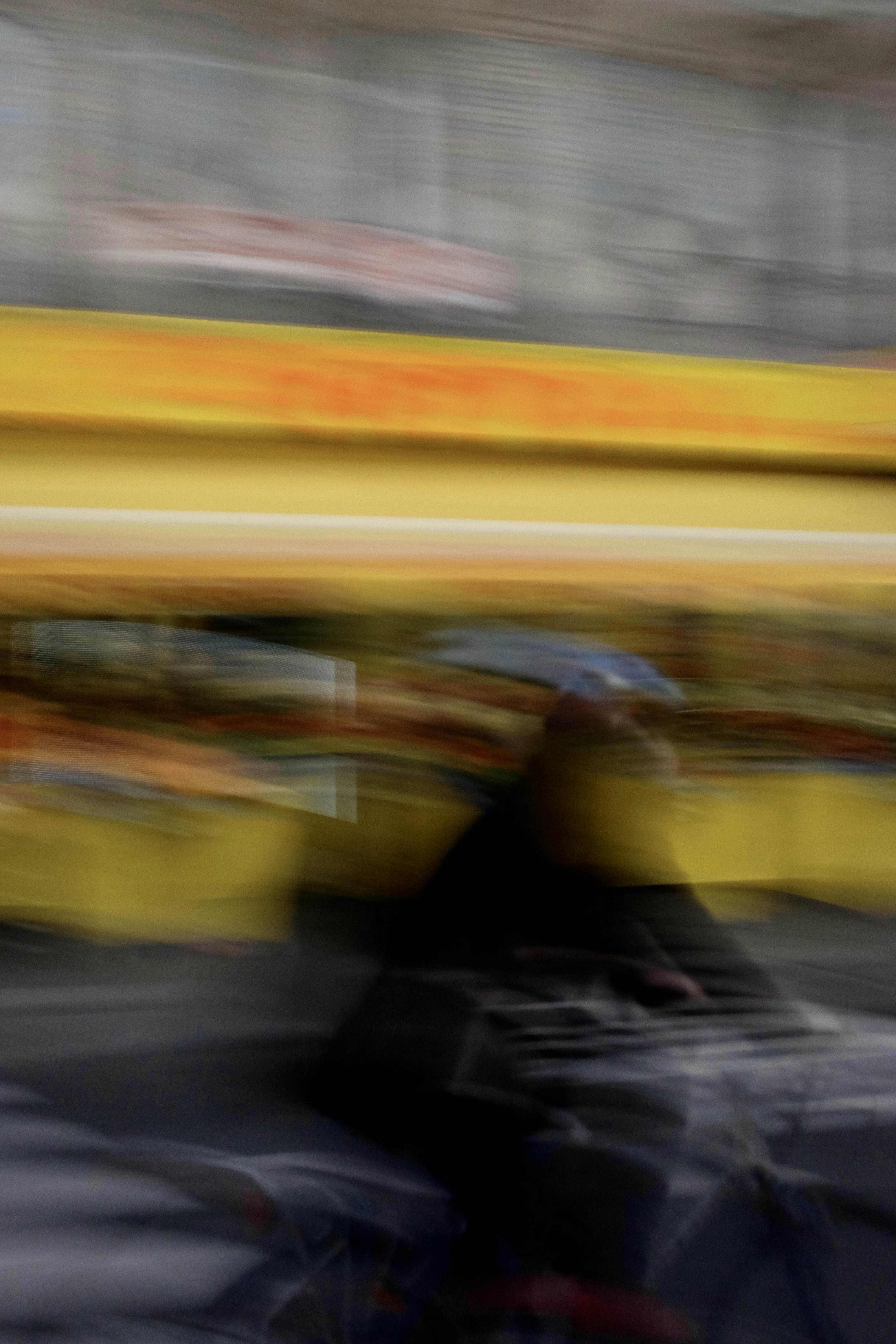 Motion Blur in Yellow Transit: A Blur of City Vibe