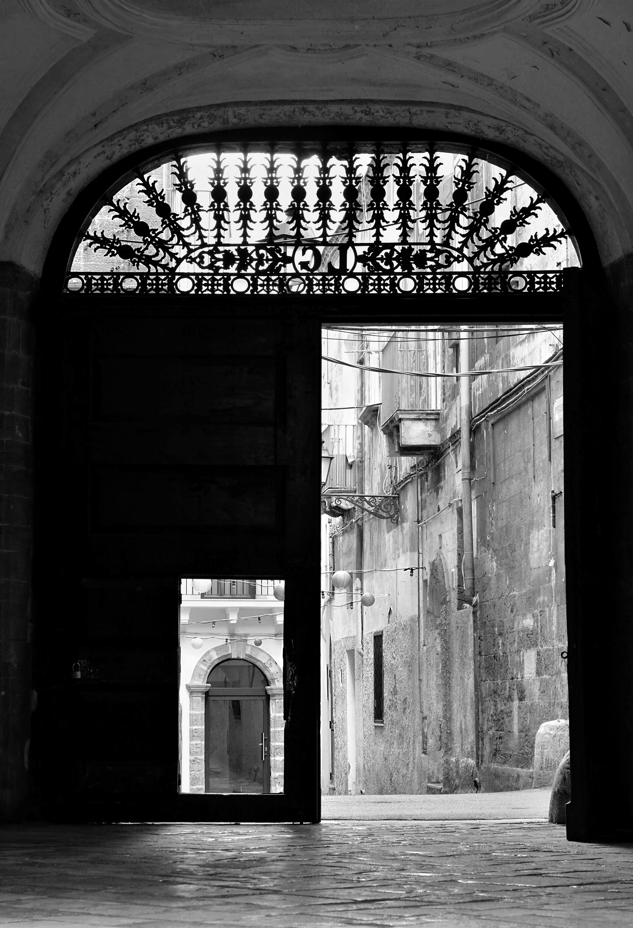 Through the Arch: A Timeless Doorway into Narrow Streets