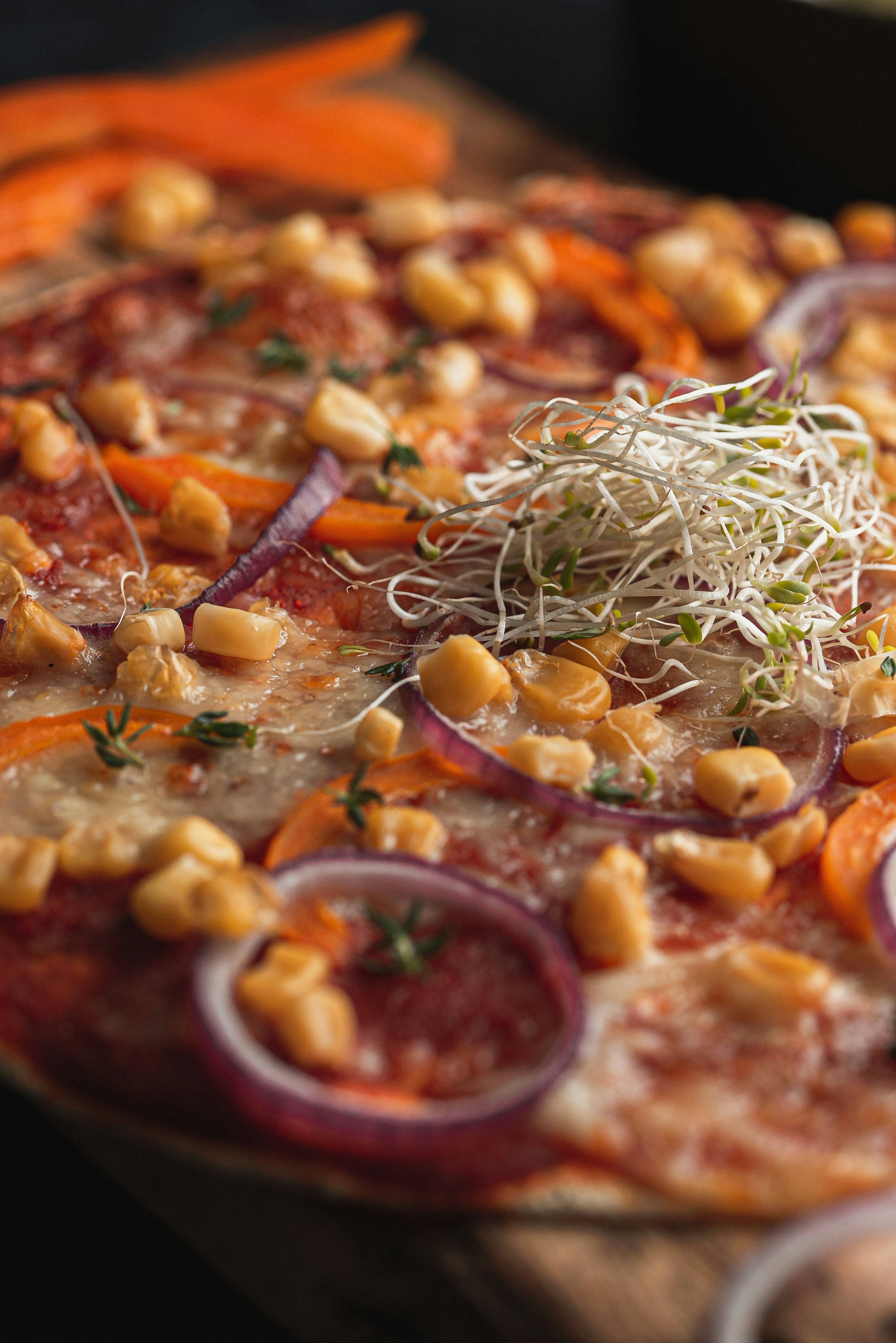 Microgreens Crown: A Pepperoni-Pecan Pizza Close-Up