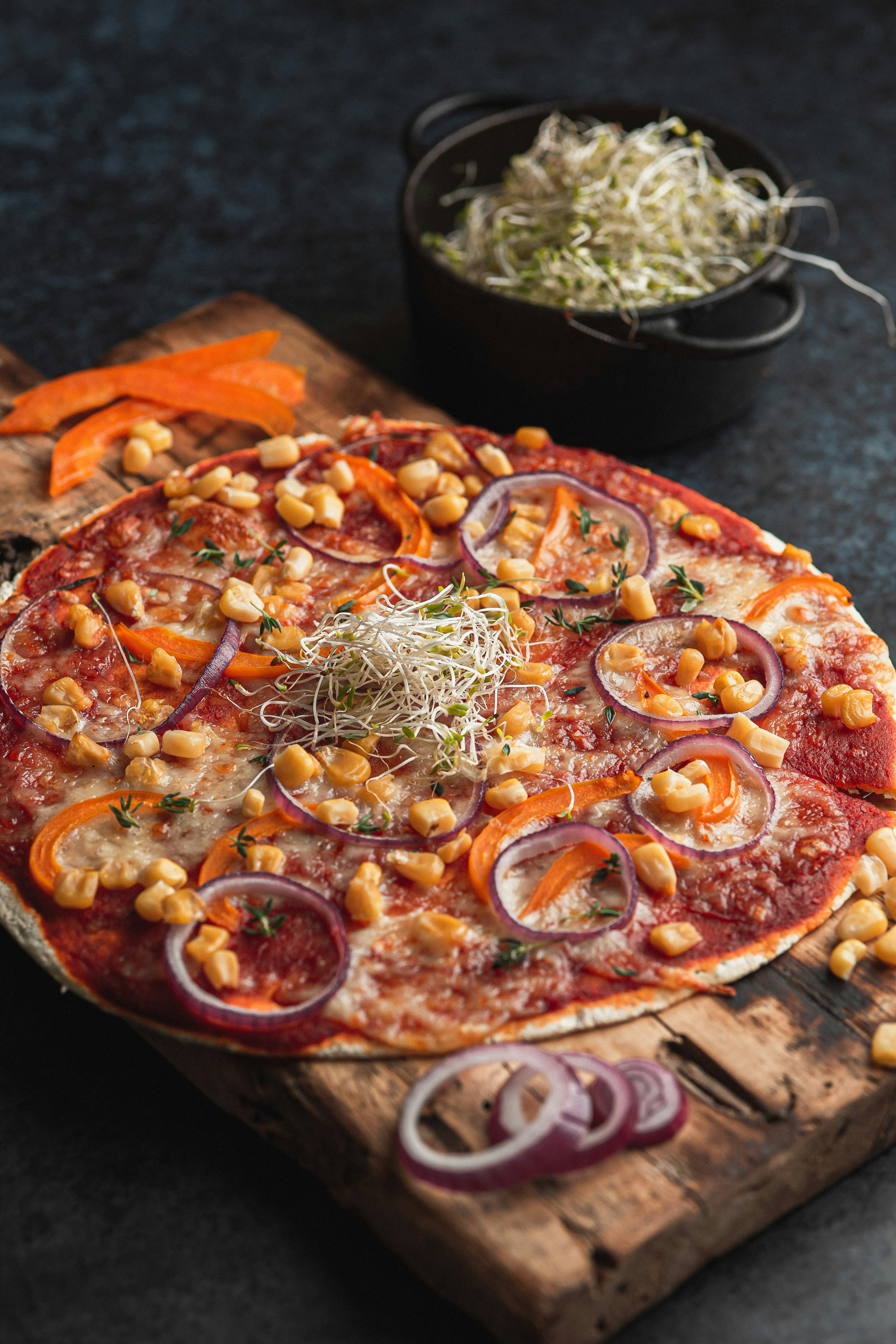 Charred Circular Feast: Pepperoni Pizza on a Rustic Board