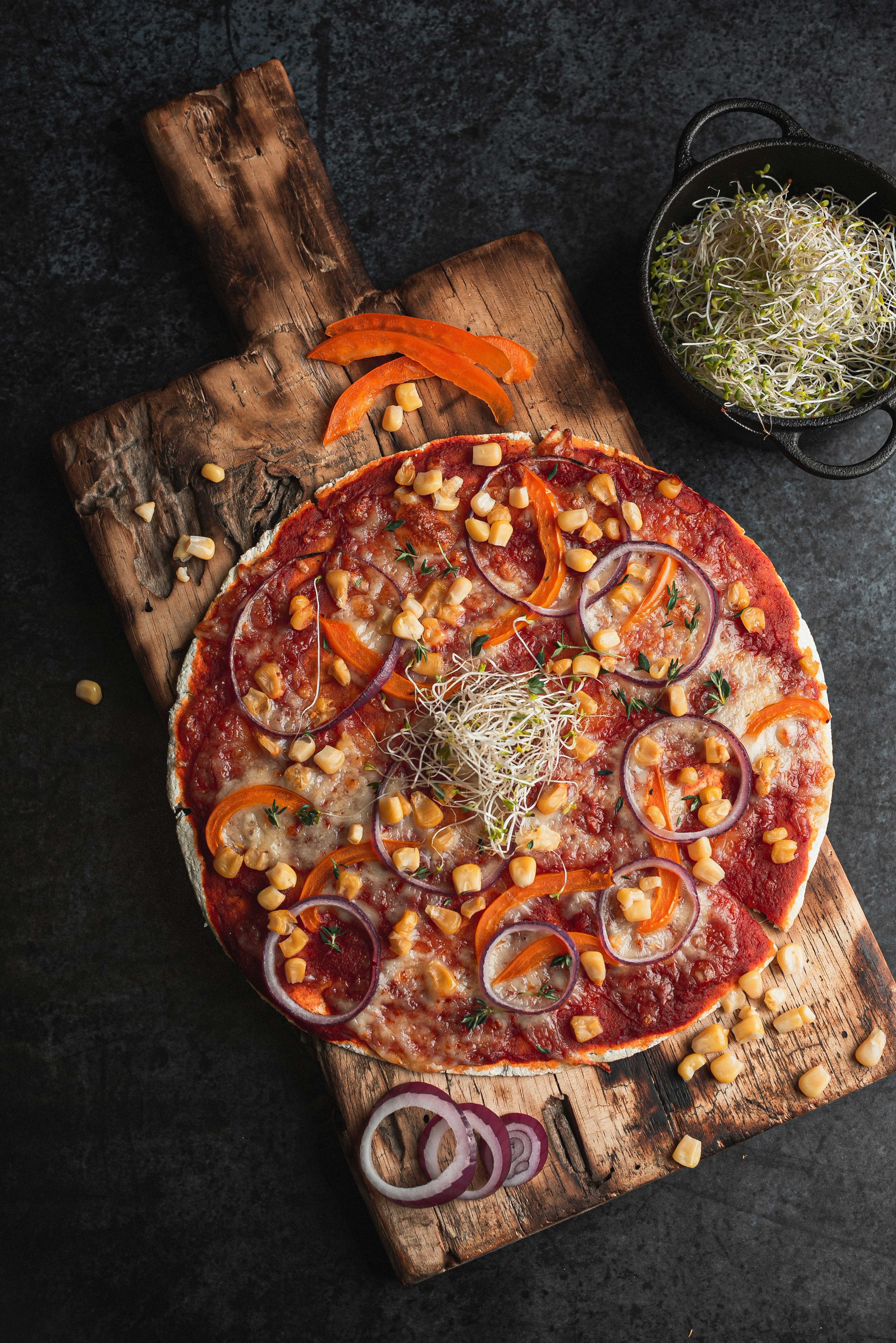 Charred Board: A Rustic Pepperoni Pizza on a Warped Wooden Board