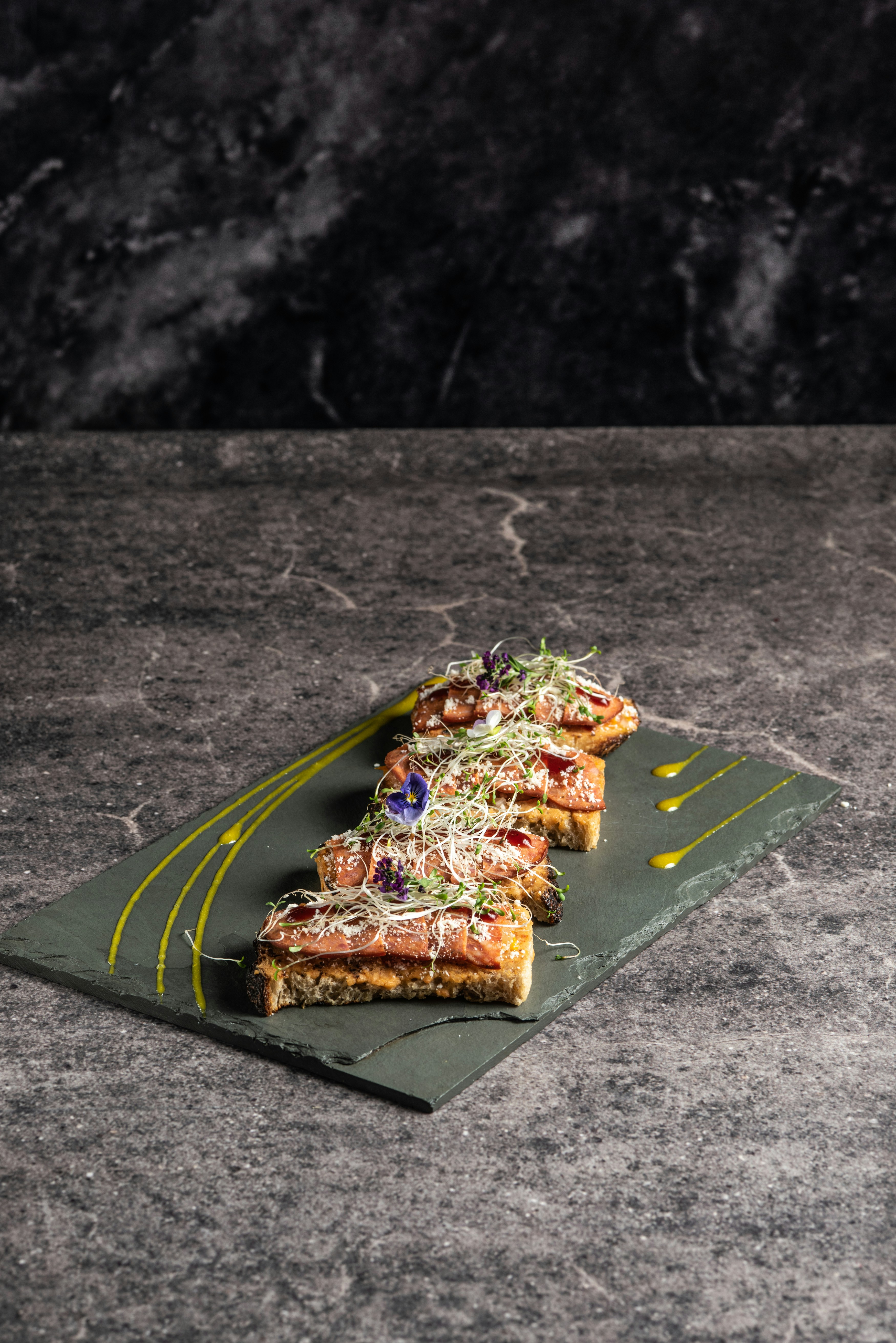 Savory Edible Stack: Crispy Toasts with Microgreen Garnish