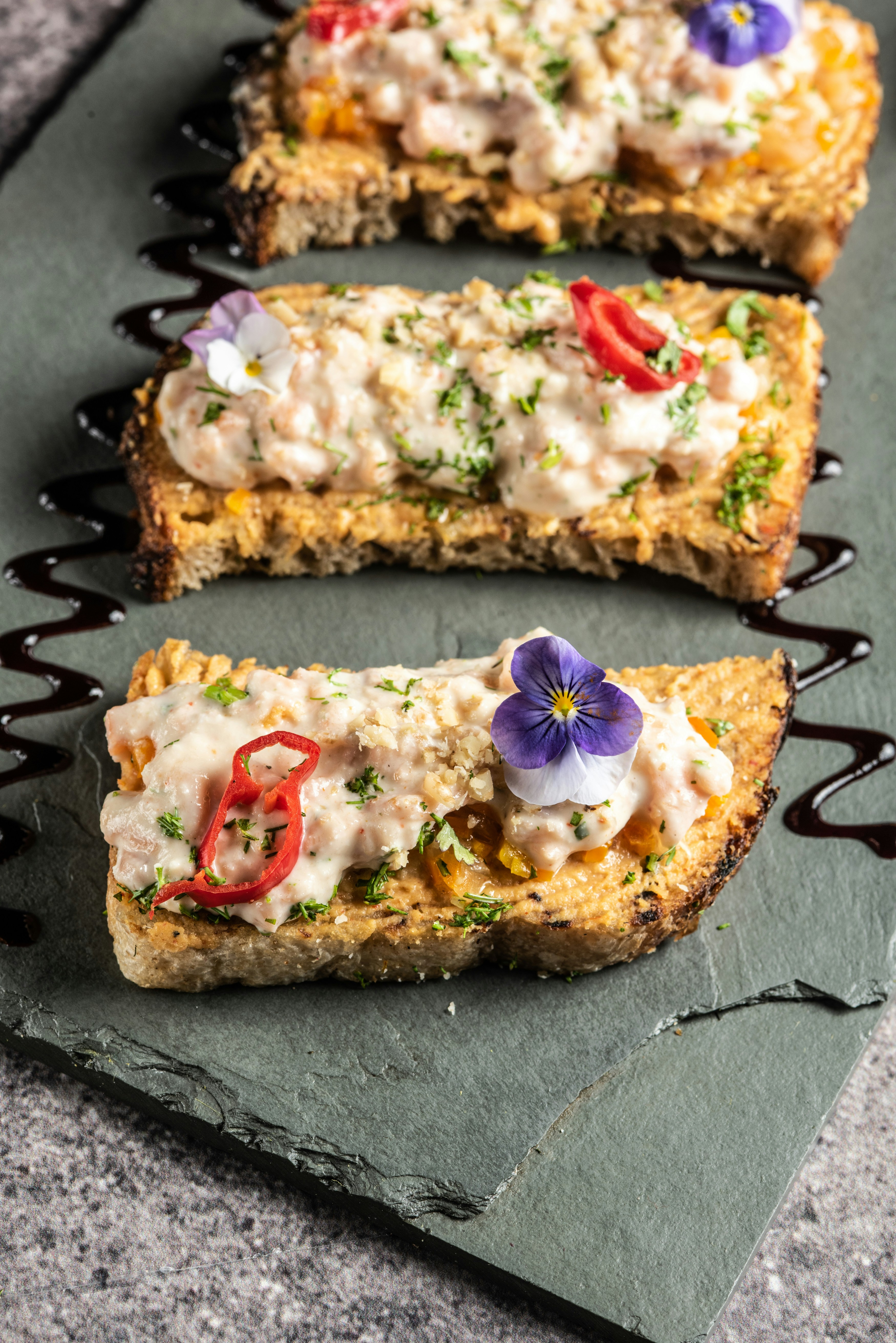 Crisped Toasts with Creamy Herb-Topped Topping and Edible Flowers