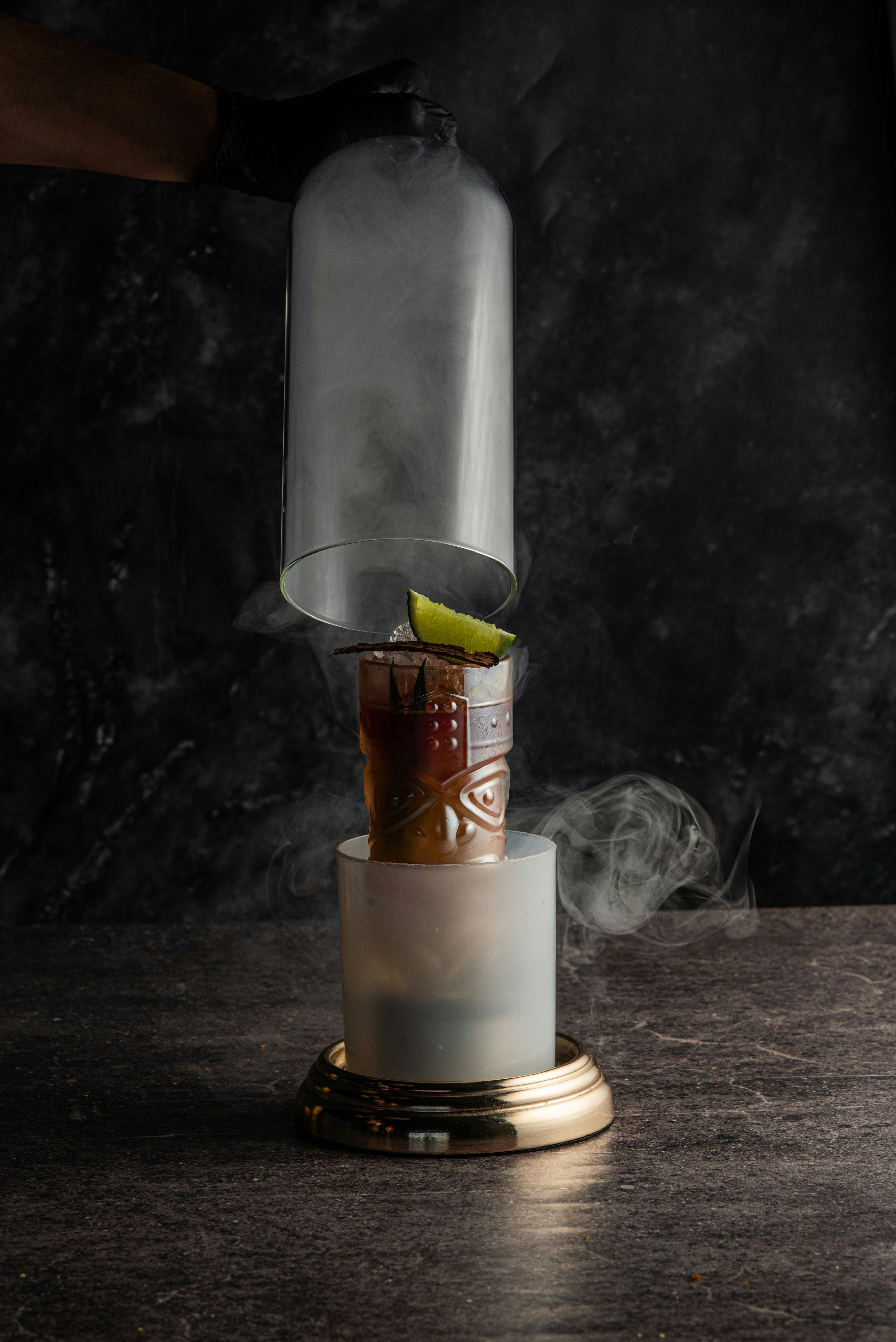 Liquid Inferno: A Lime Drop Balancing on Fire-Torgued Glass