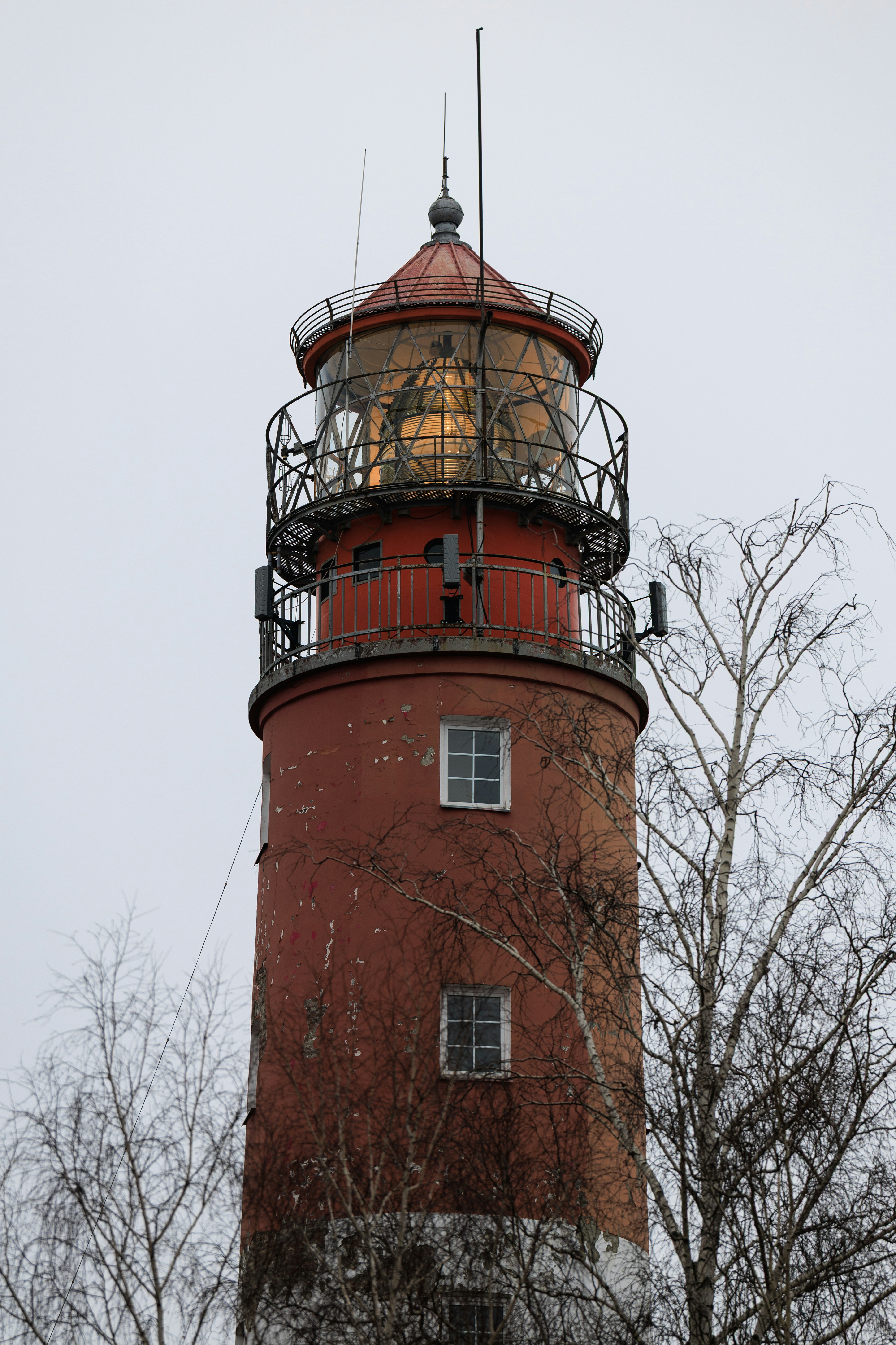 Red Beacon in Winter: A solitary lighthouse Reaching Skyward