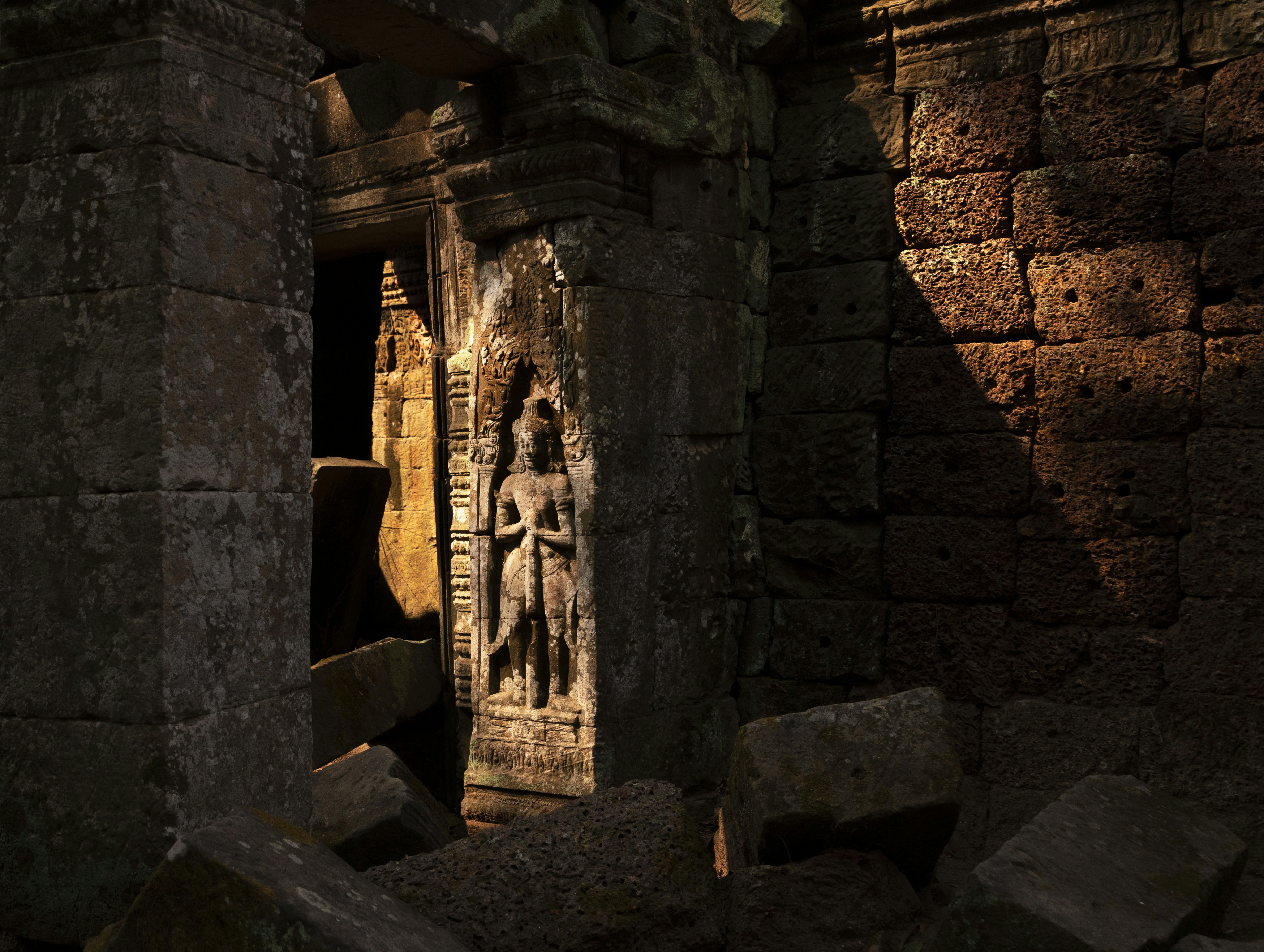 Gloomy Carved Gate in Mossy Temple Verge