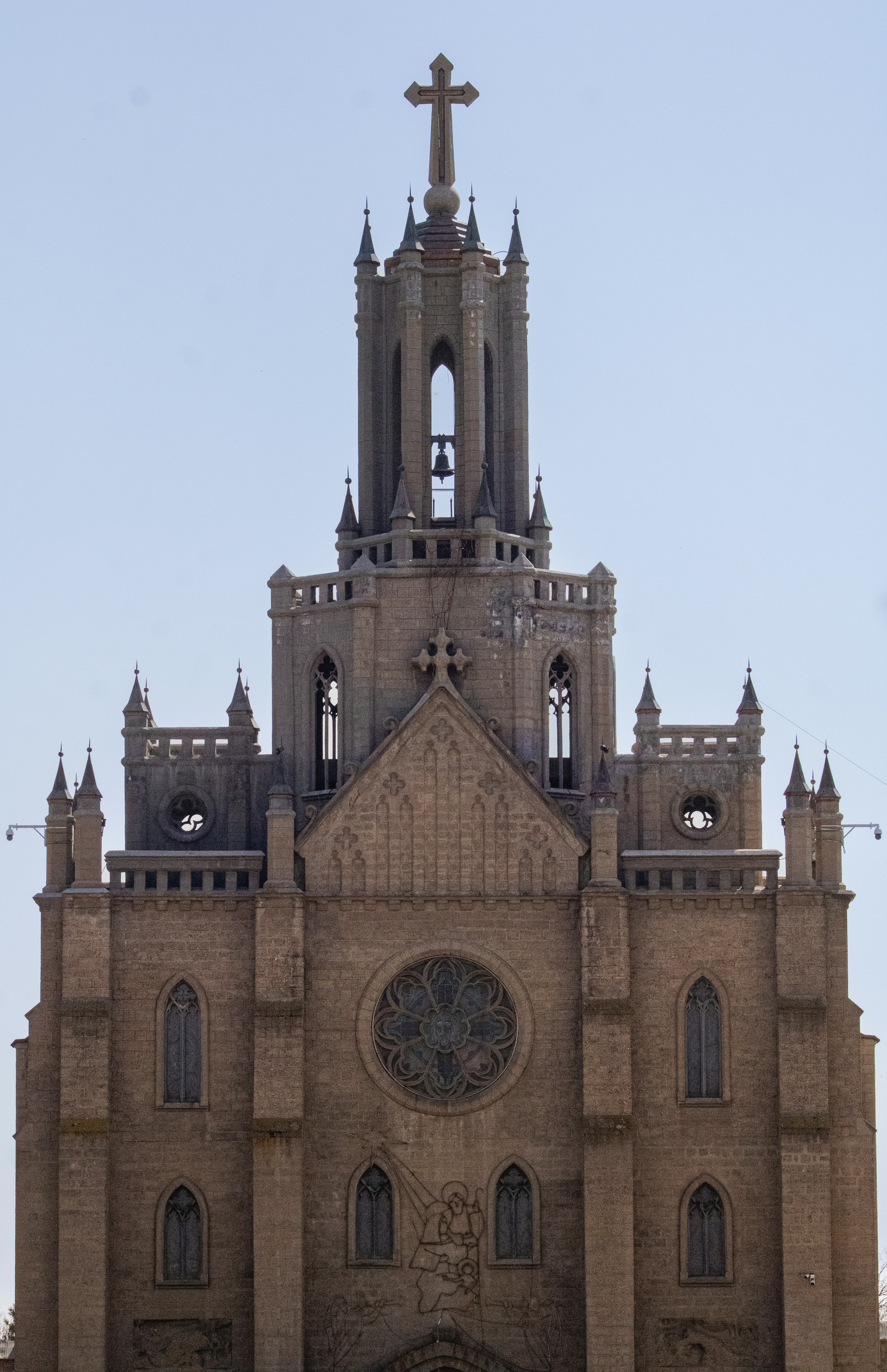 Gothic Church Facade Reaching Toward a Clear Sky