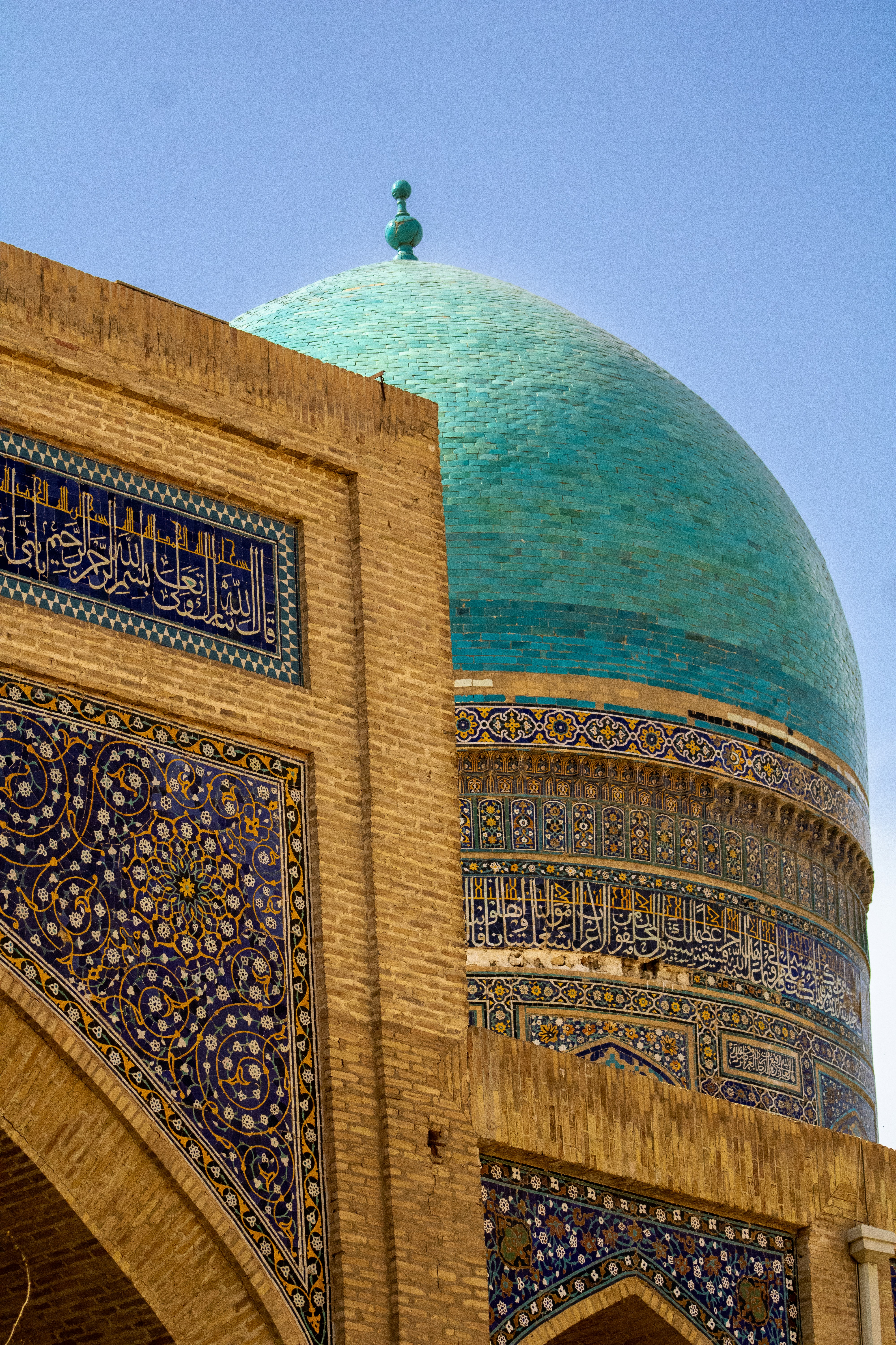 Teal Dome over Brick Arch: A Detail of Islamic Architecture