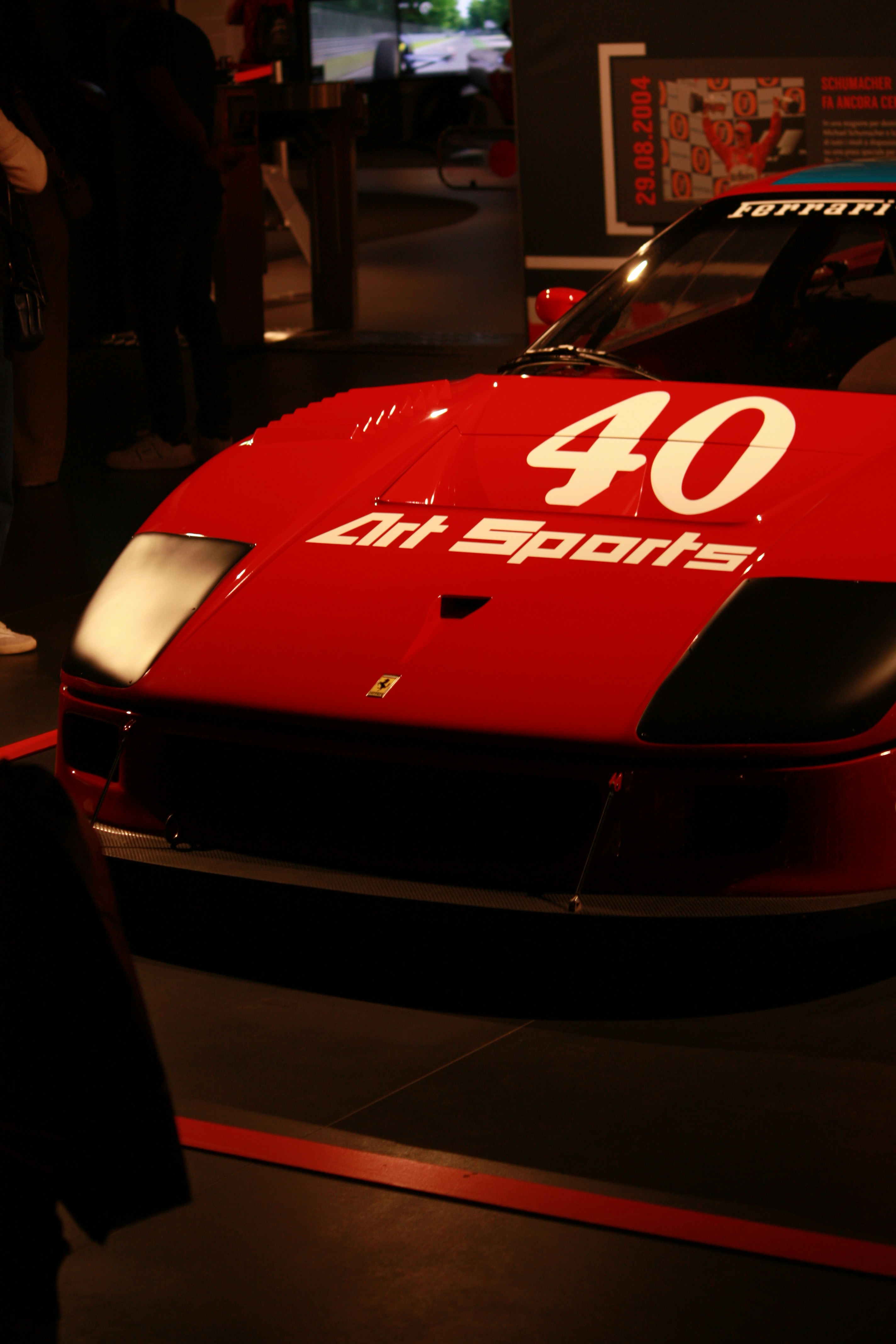 Red Ferrari Showpiece at the Auto Expo: Bold Numbers, Glossy Finish