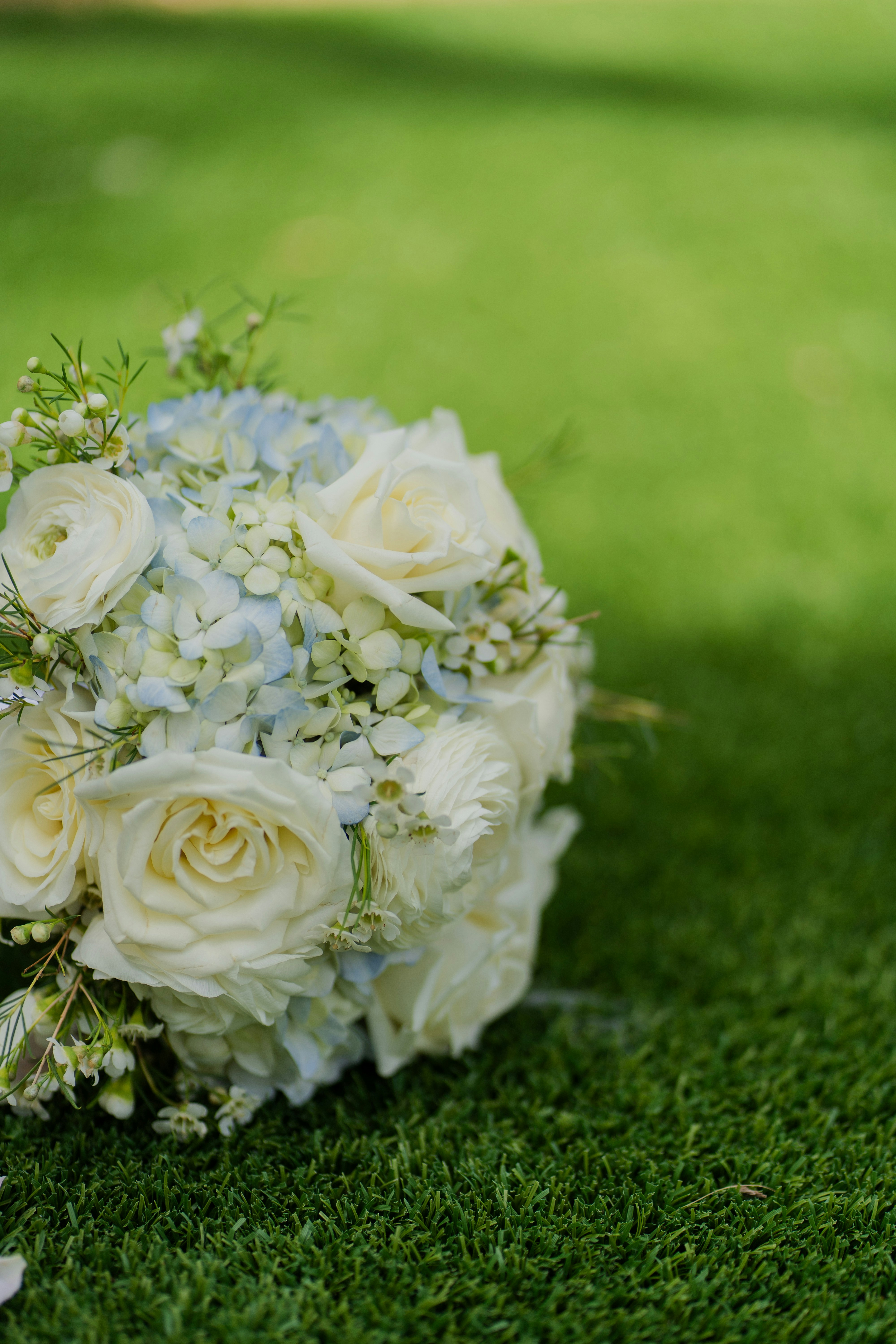 Ivory Bouquet Resting on Velvet Green