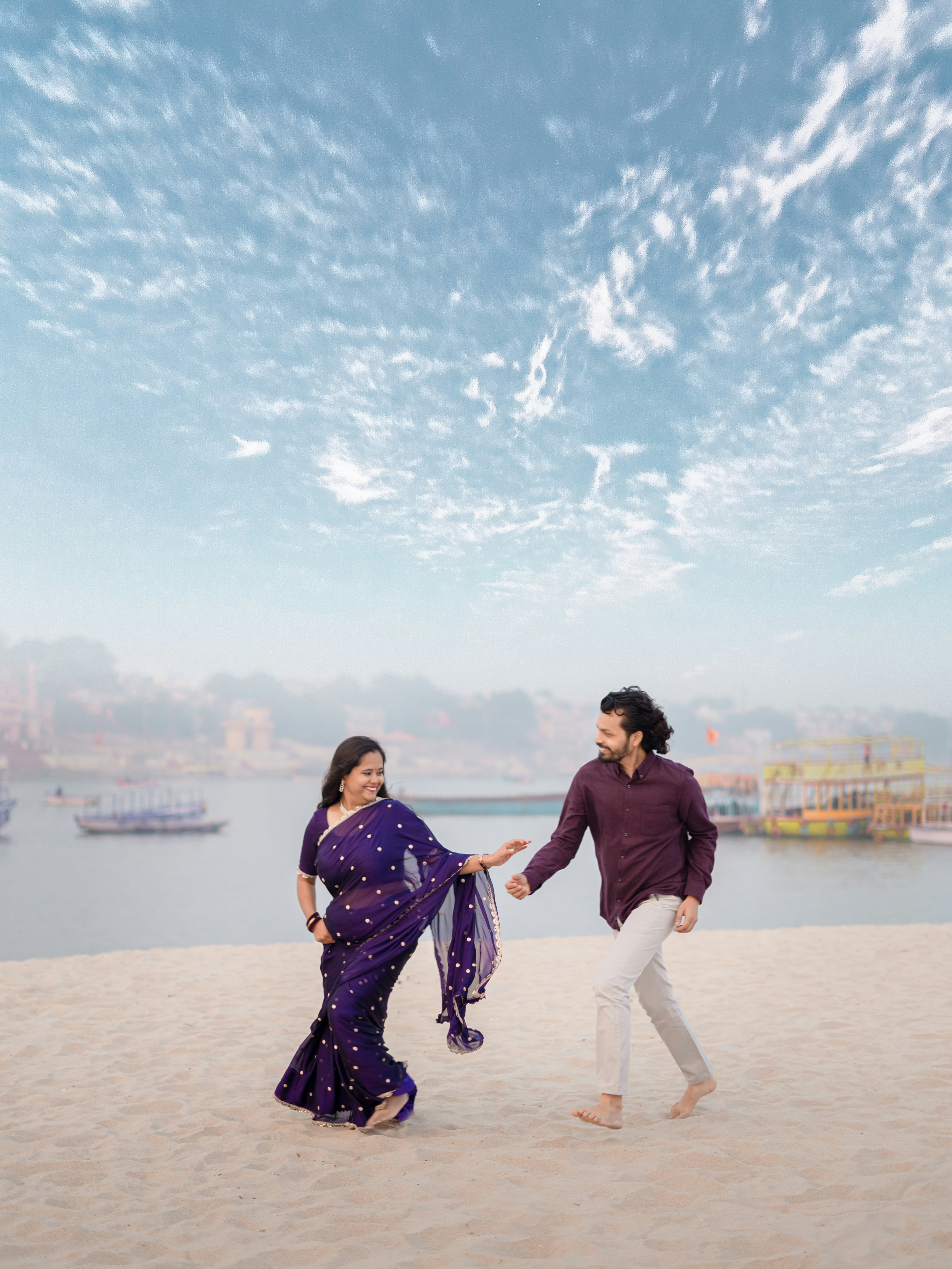Beachside Duo: A Tender Dance on Sunlit Sand