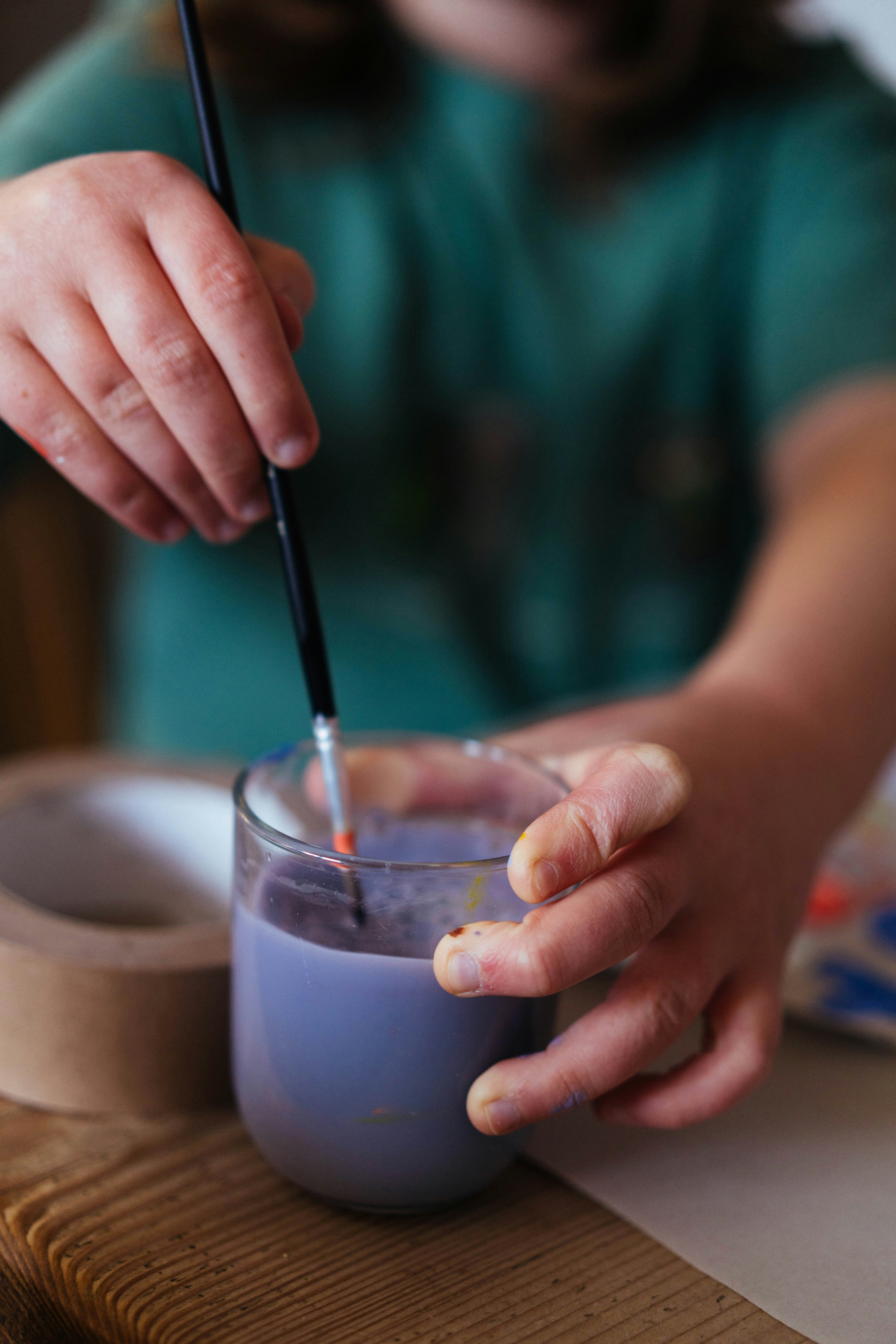 Hands at Work: A Brush Dips into Soft Lavender Glass