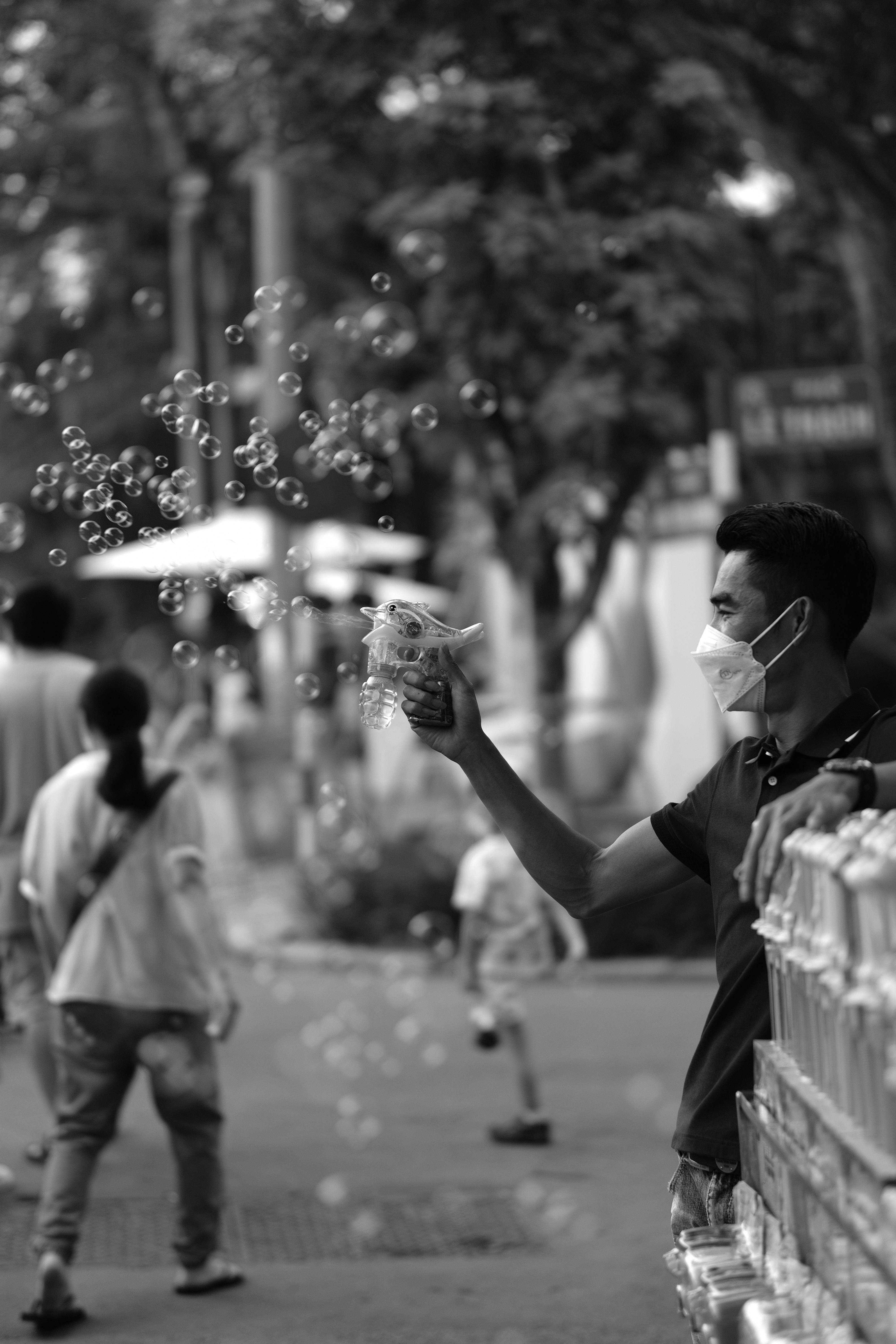 Bubble Moment: Street Vendor Sprays Hope in Black and White