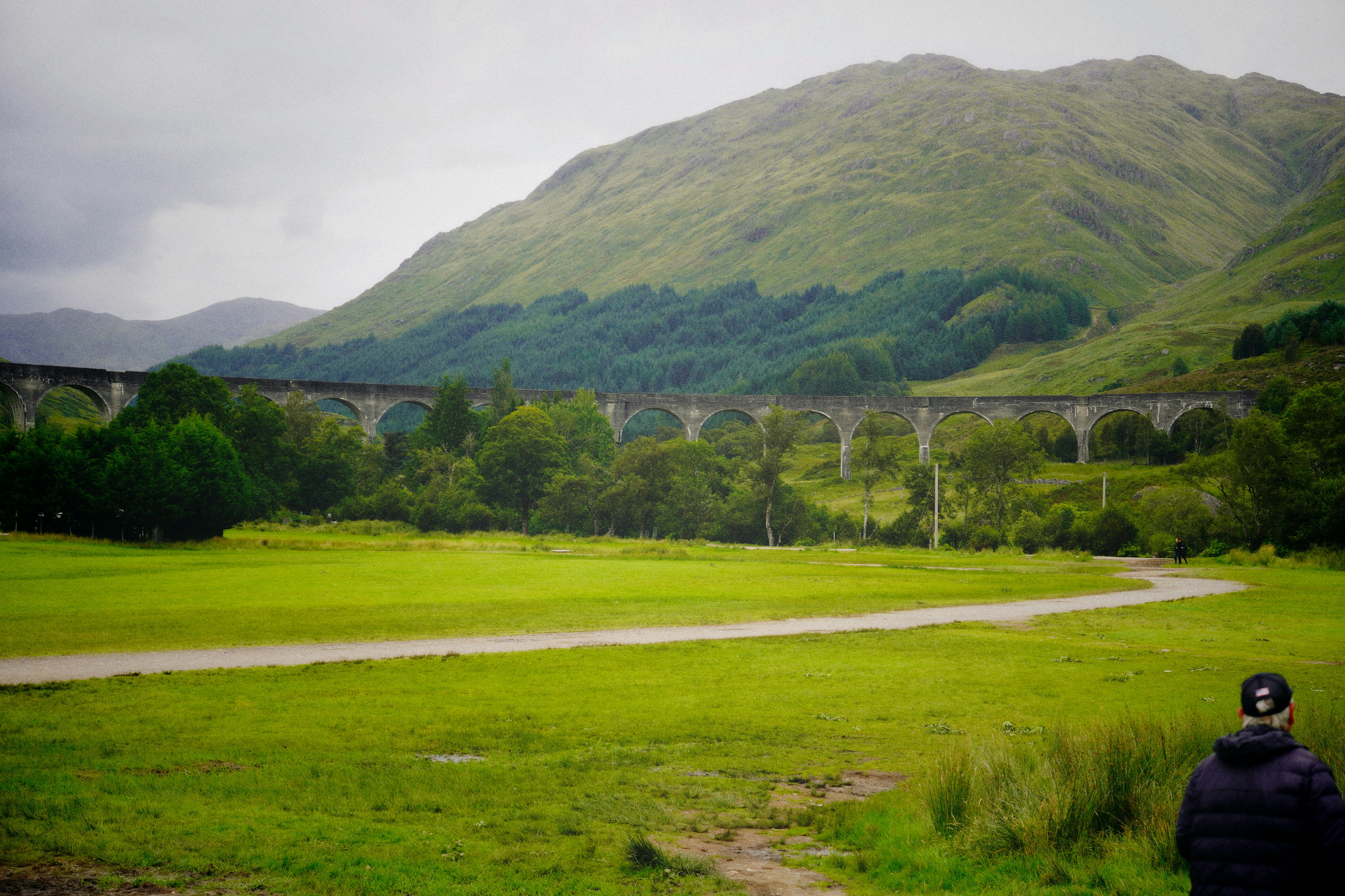 Rugged valley, distant viaduct, and hillside dawn